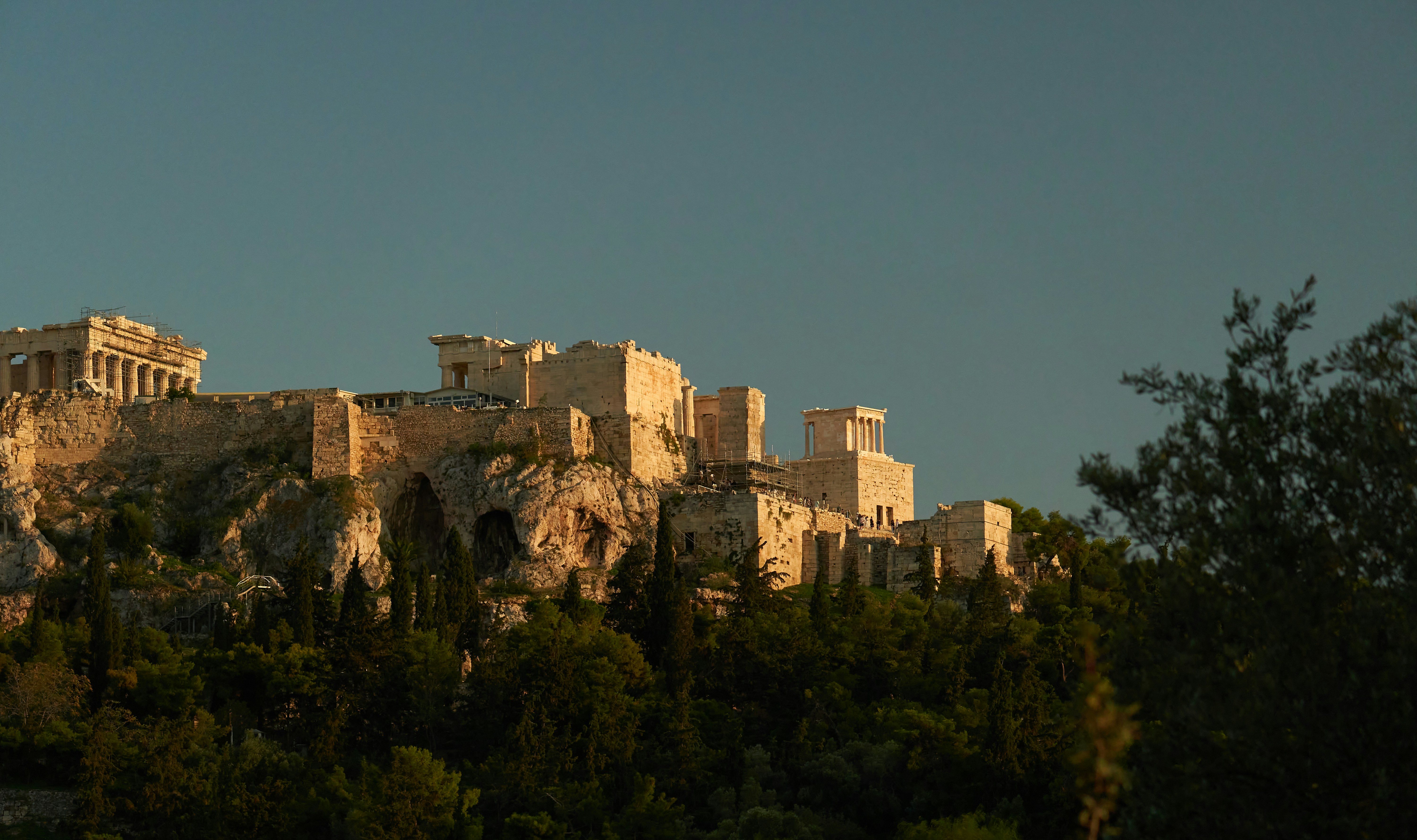 a very tall building on top of a hill