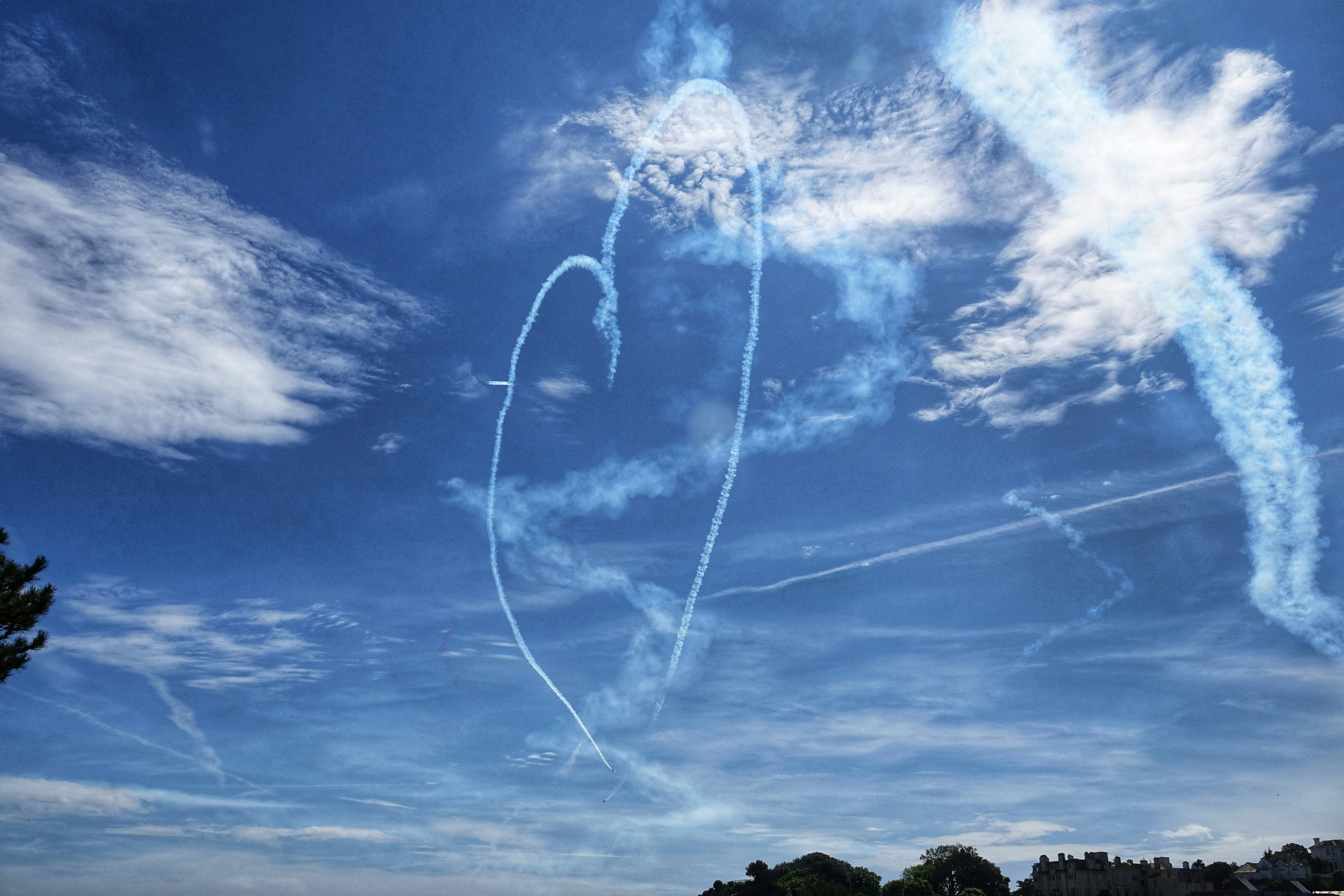 The Red Arrows create a smoke heart at the Torbay Air Show.
