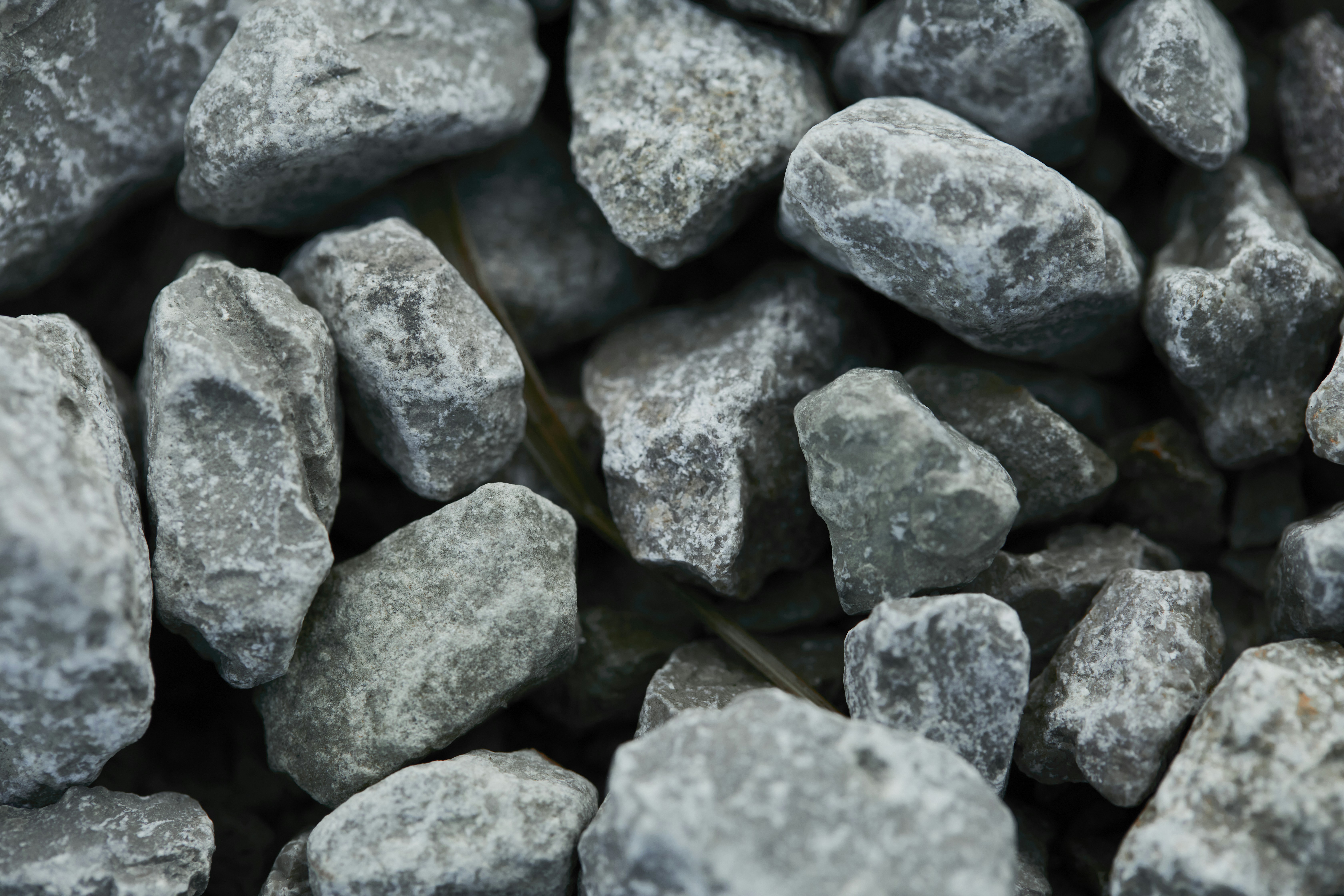 A pile of gray rocks sitting next to each other photo – Free Macro ...