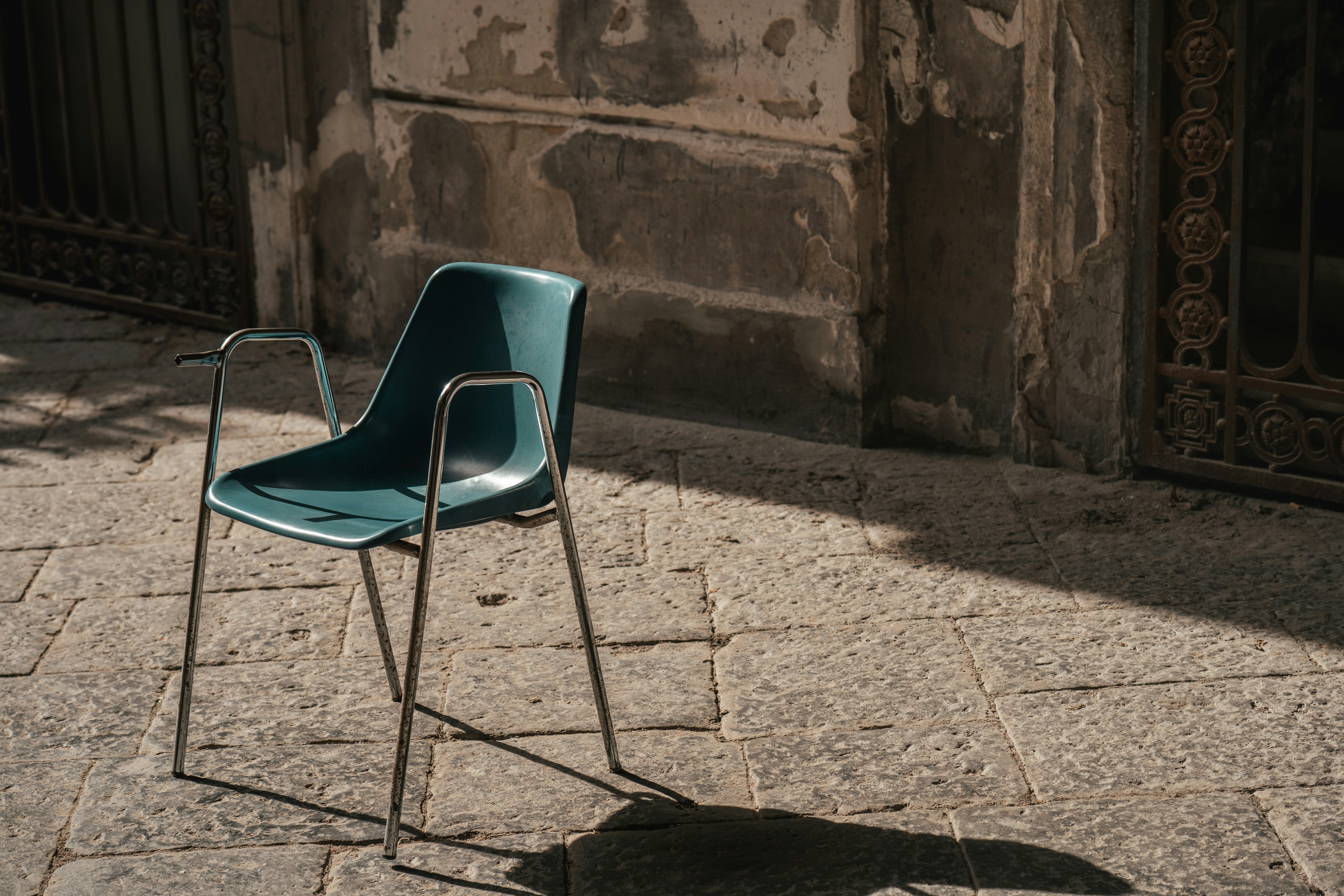 MCM chair in a sun-lit corridor on the streets of Naples, Italy.