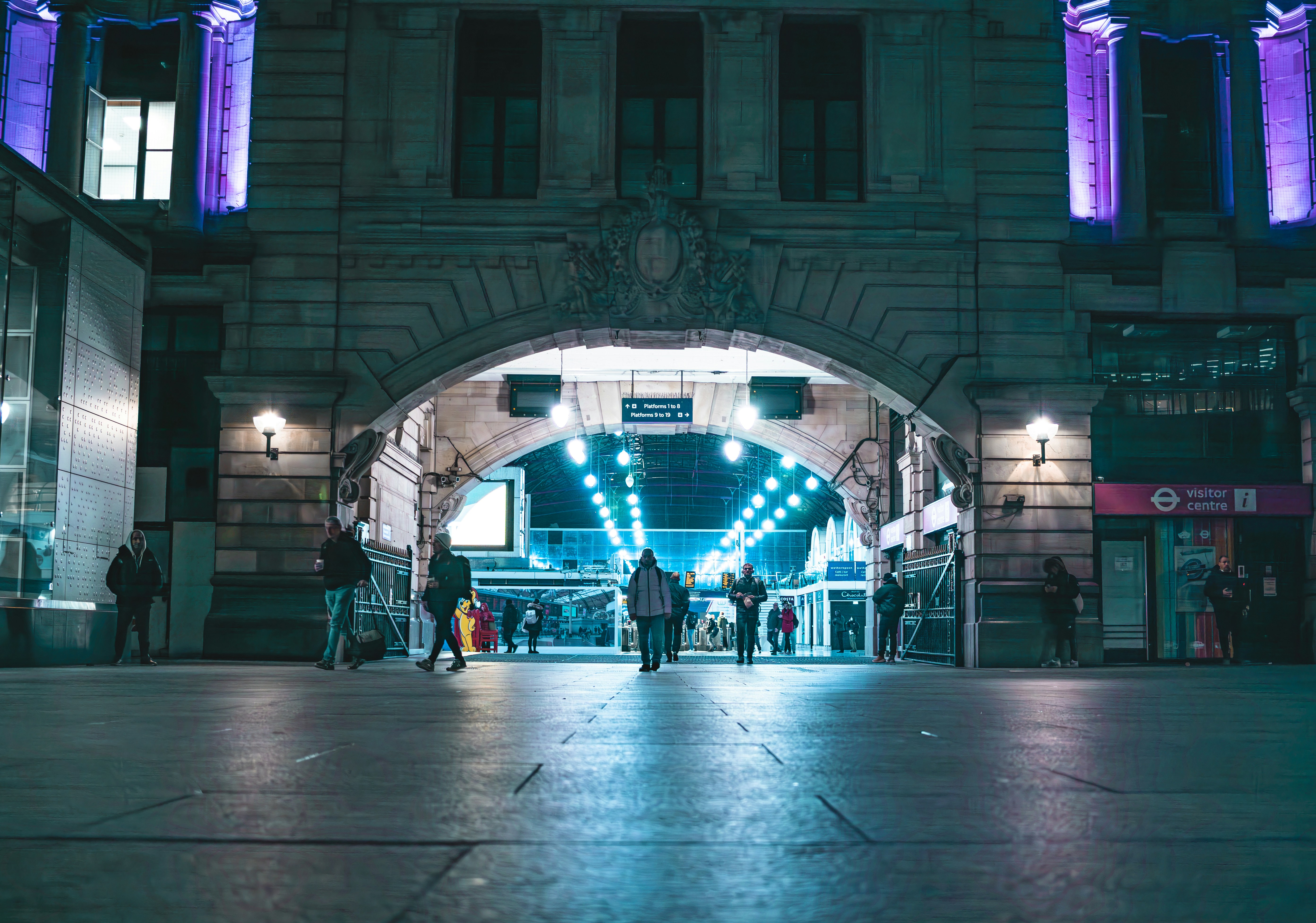 Blue Neon Gateway: Night Walk Beneath the City Arch