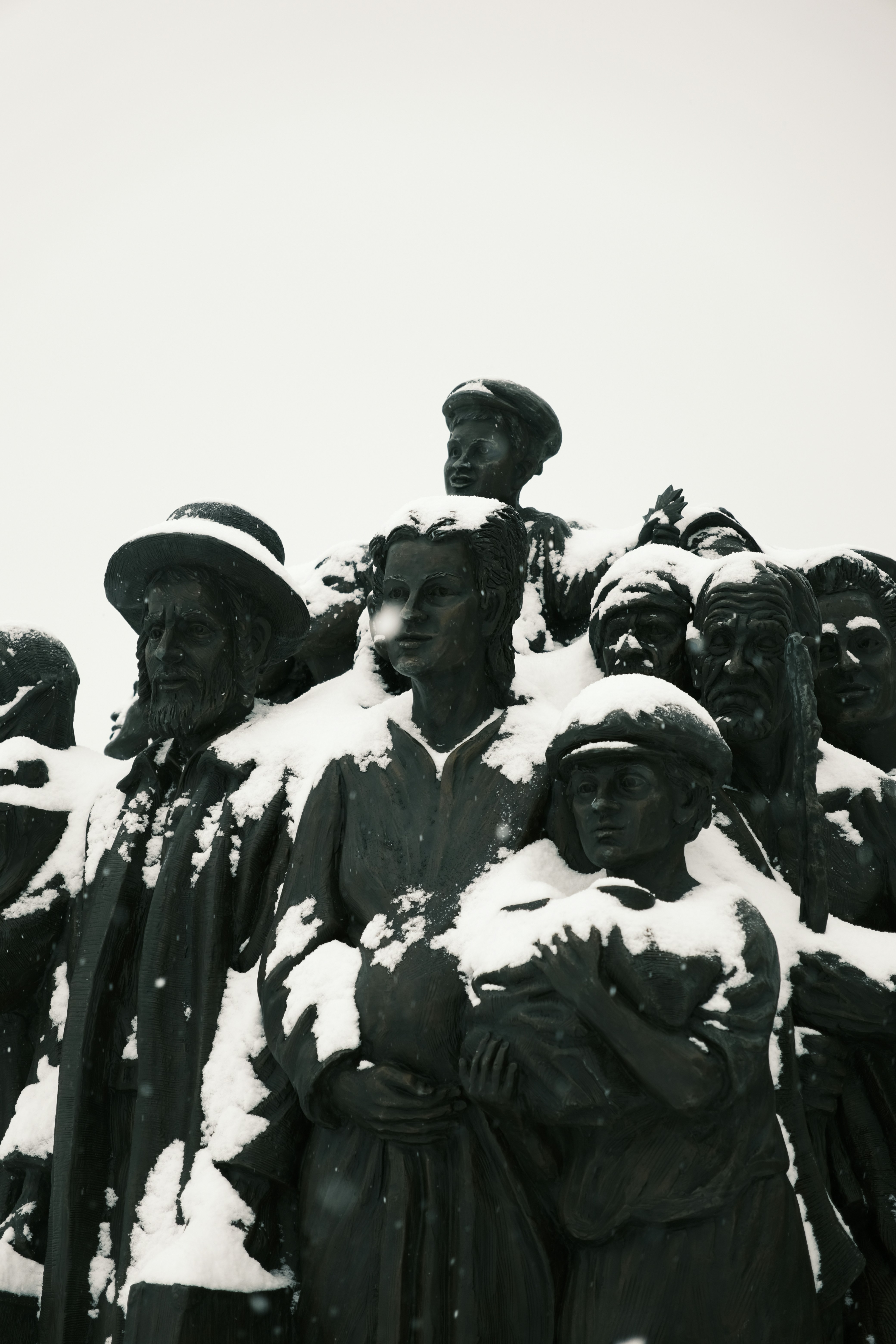 Snowbound Ensemble: A Monumental Moment Among Silent Figures