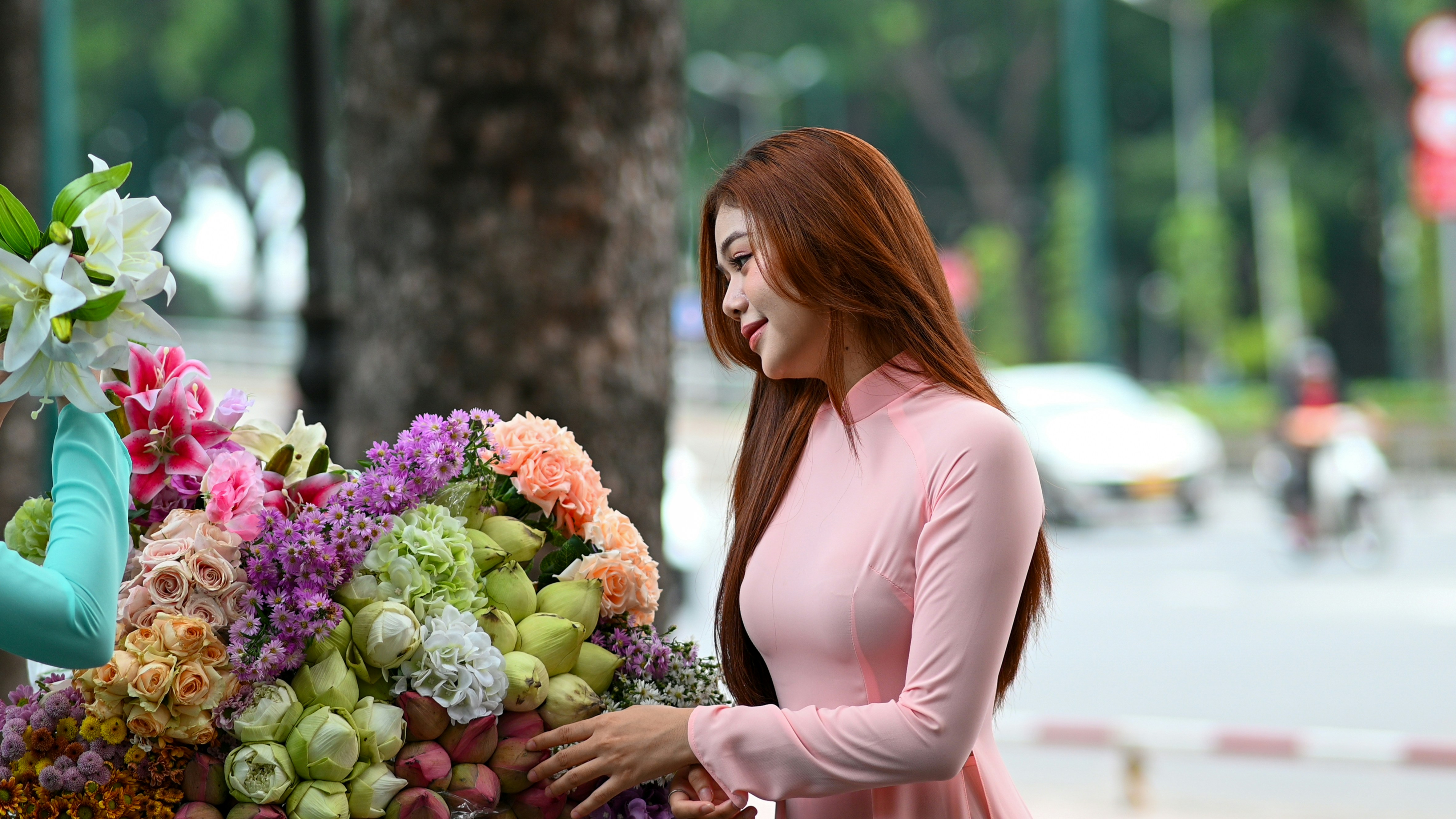 Quiet Portrait Amid a Street Florist's Color Burst