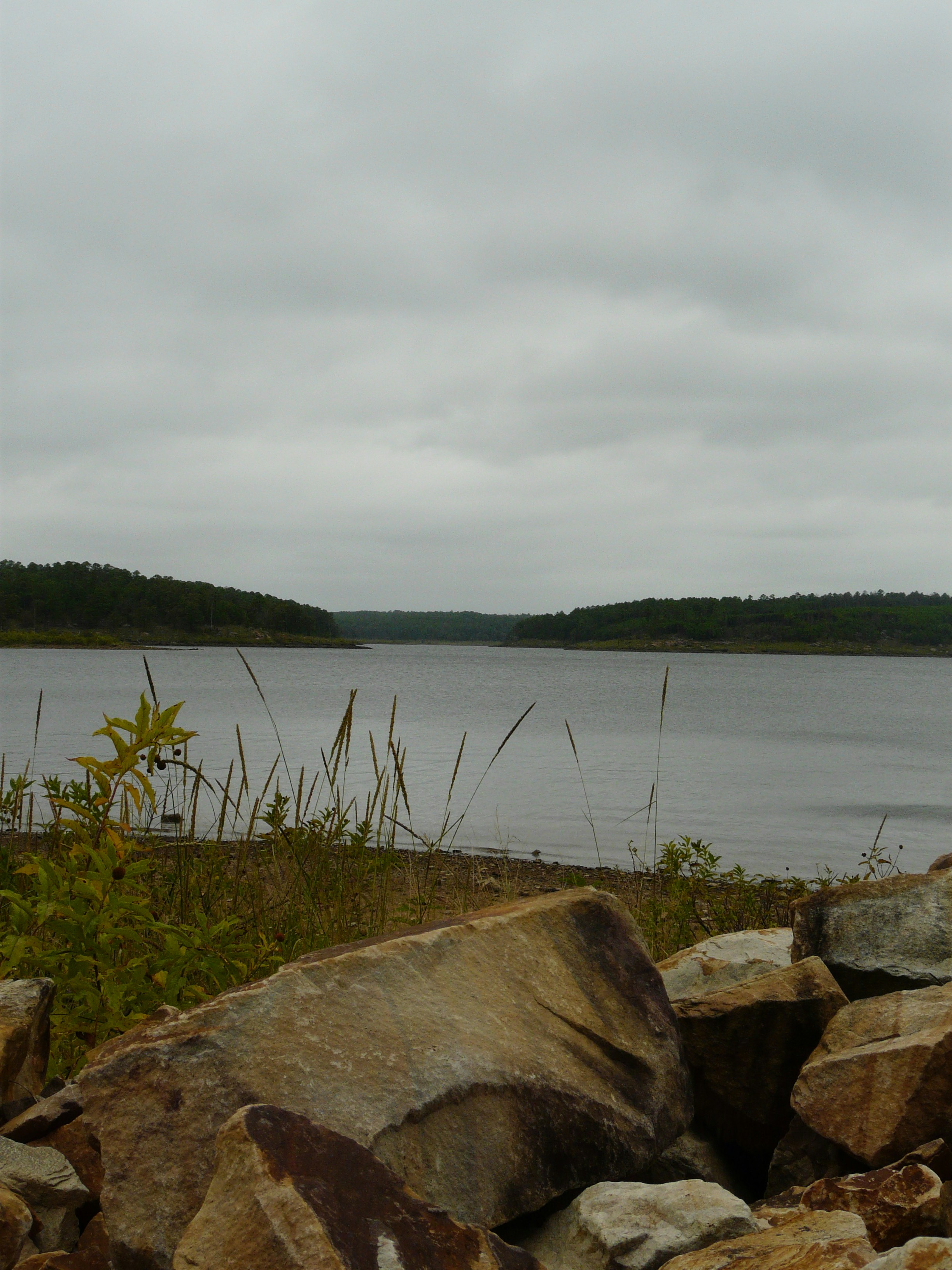 Quiet Lakeside Stones Beneath a Calm Overcast Sky