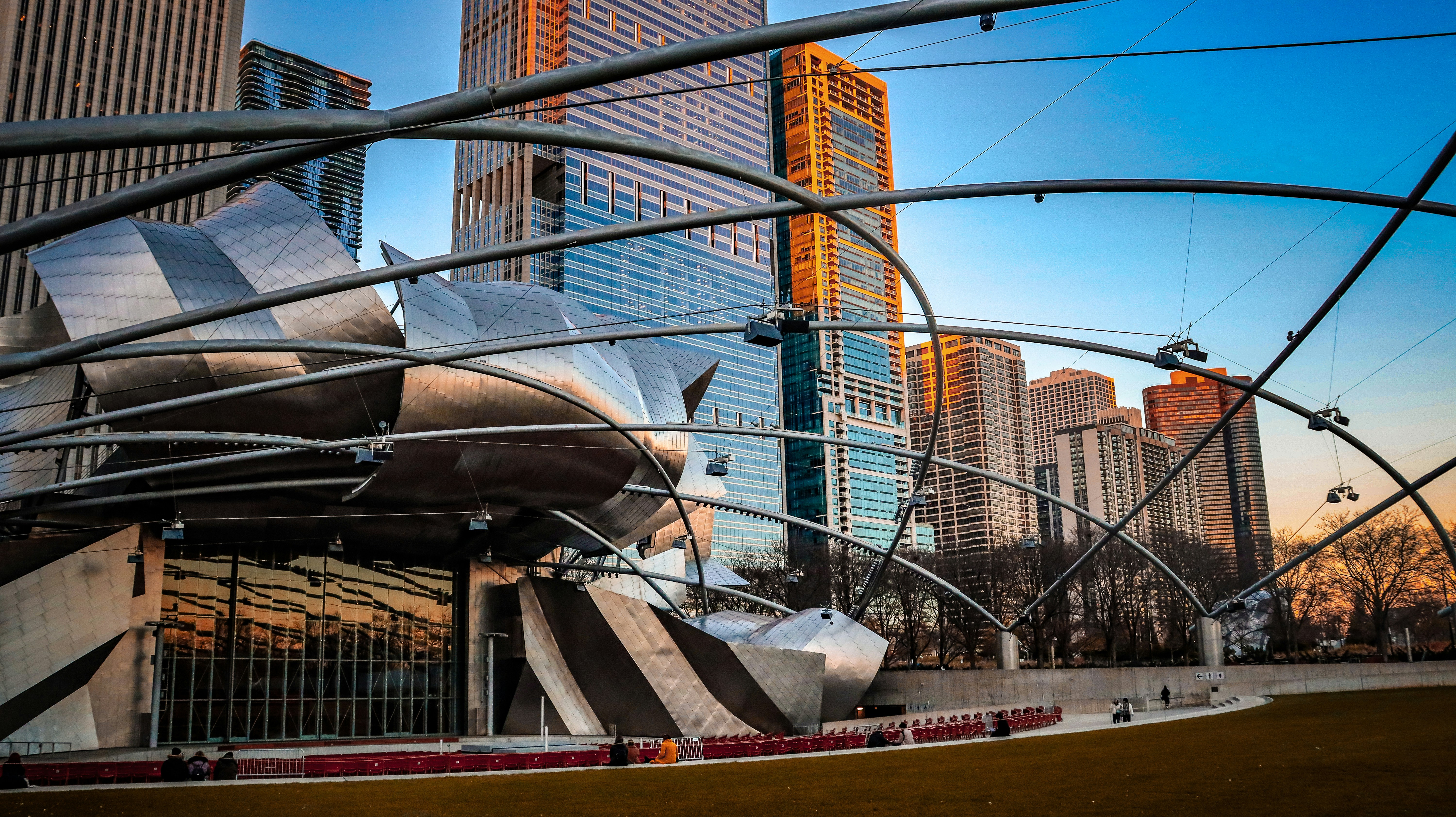 Confluence of Arches: Chrome Canopy Framing a Downtown Sunset