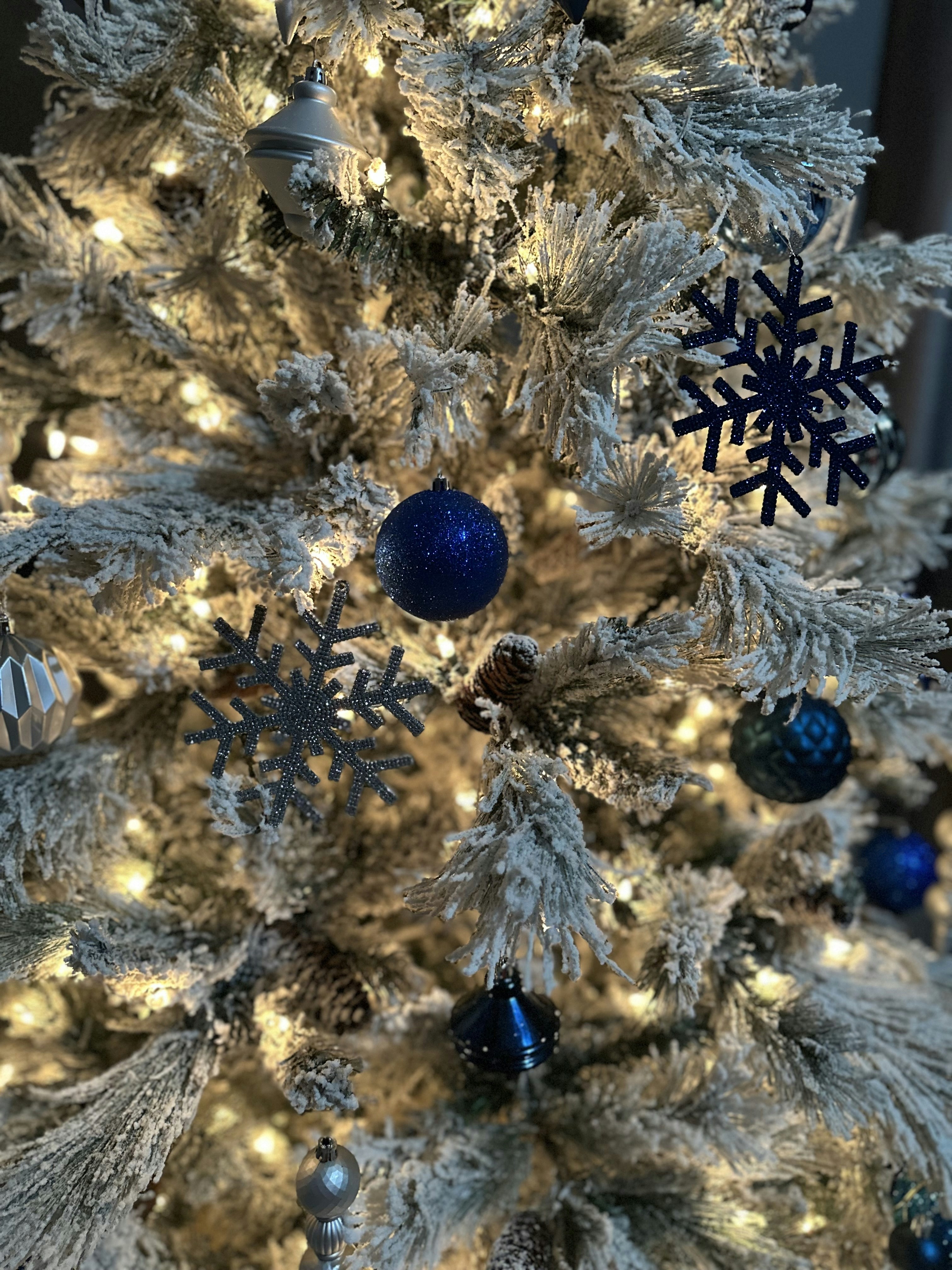 A white christmas tree with blue and silver ornaments photo – Free ...