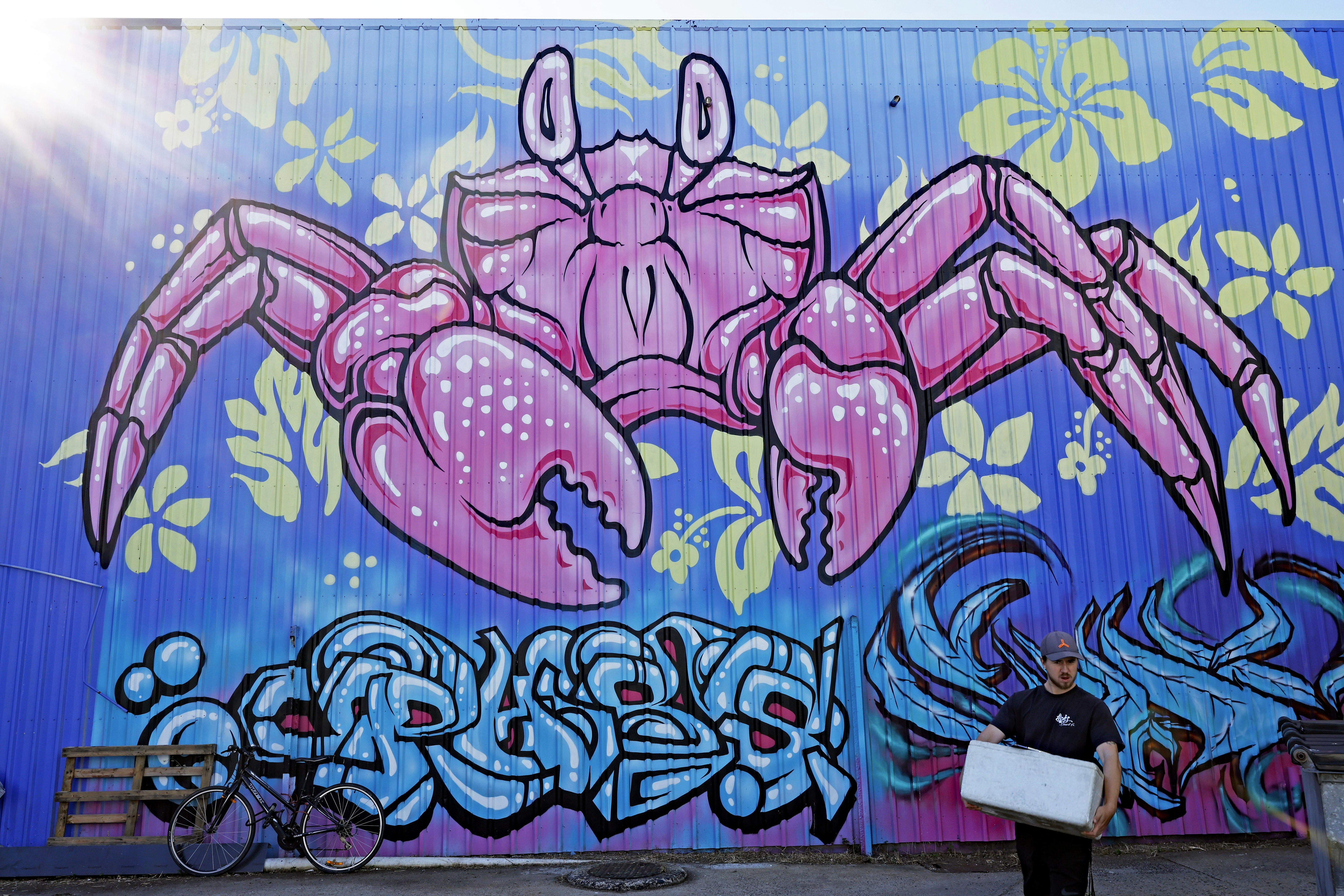 Crimson Crustacean Dominates a Neon Graffiti Wall