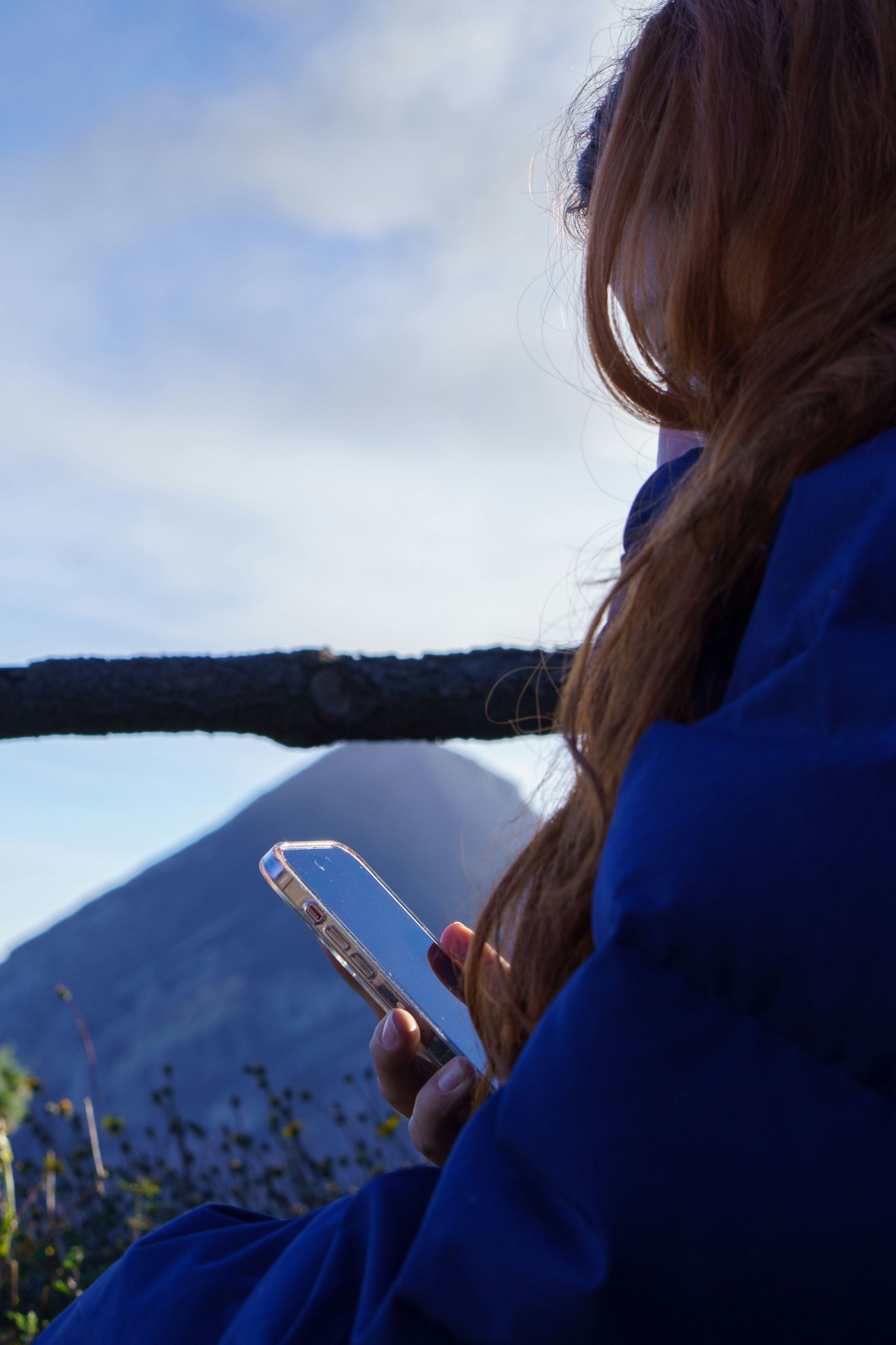 Blue Jacket, Backlit Focus: A Portrait of Quiet Connection