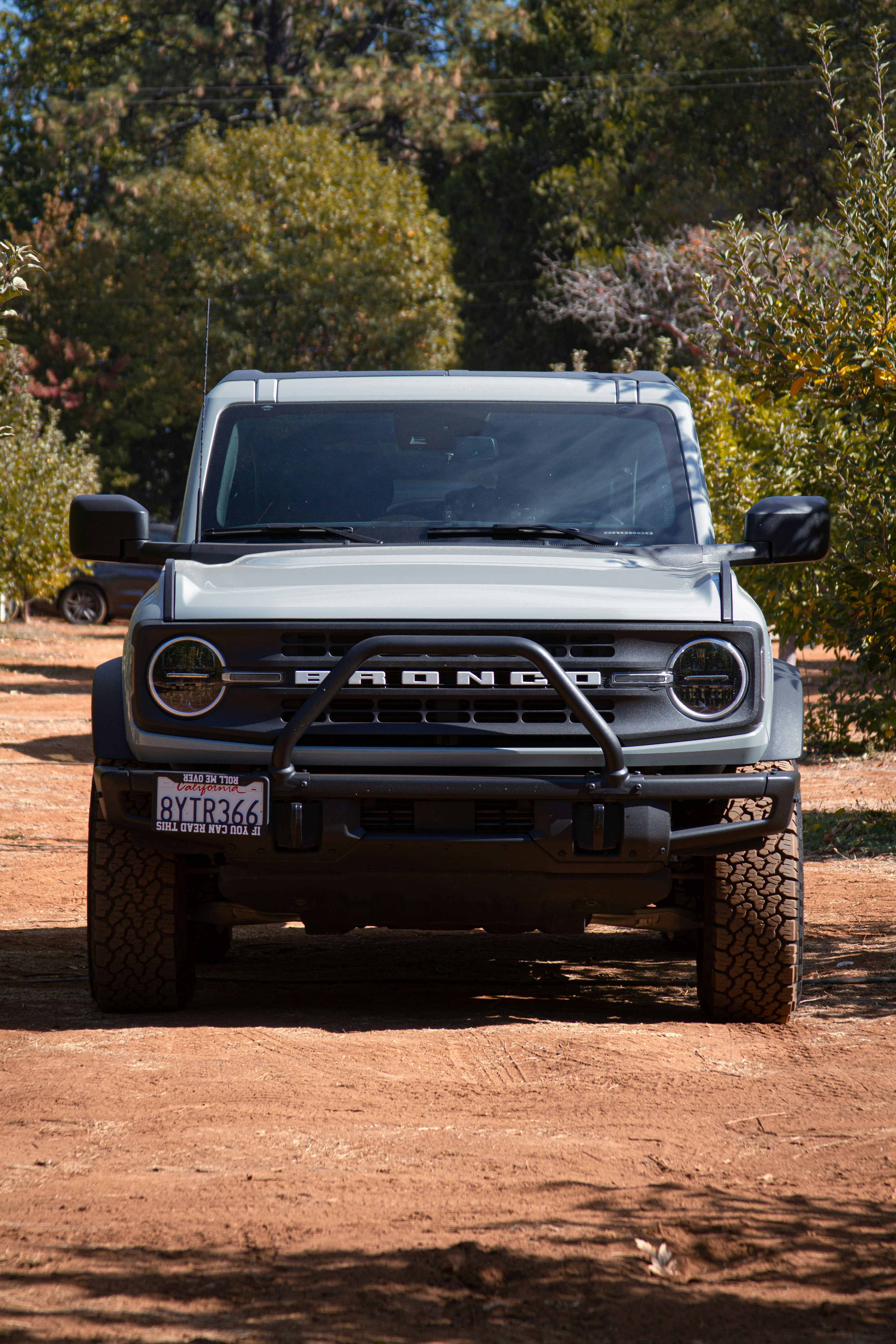 Dusty Trail Sentinel: Front View of a Bronco Ready for Adventure