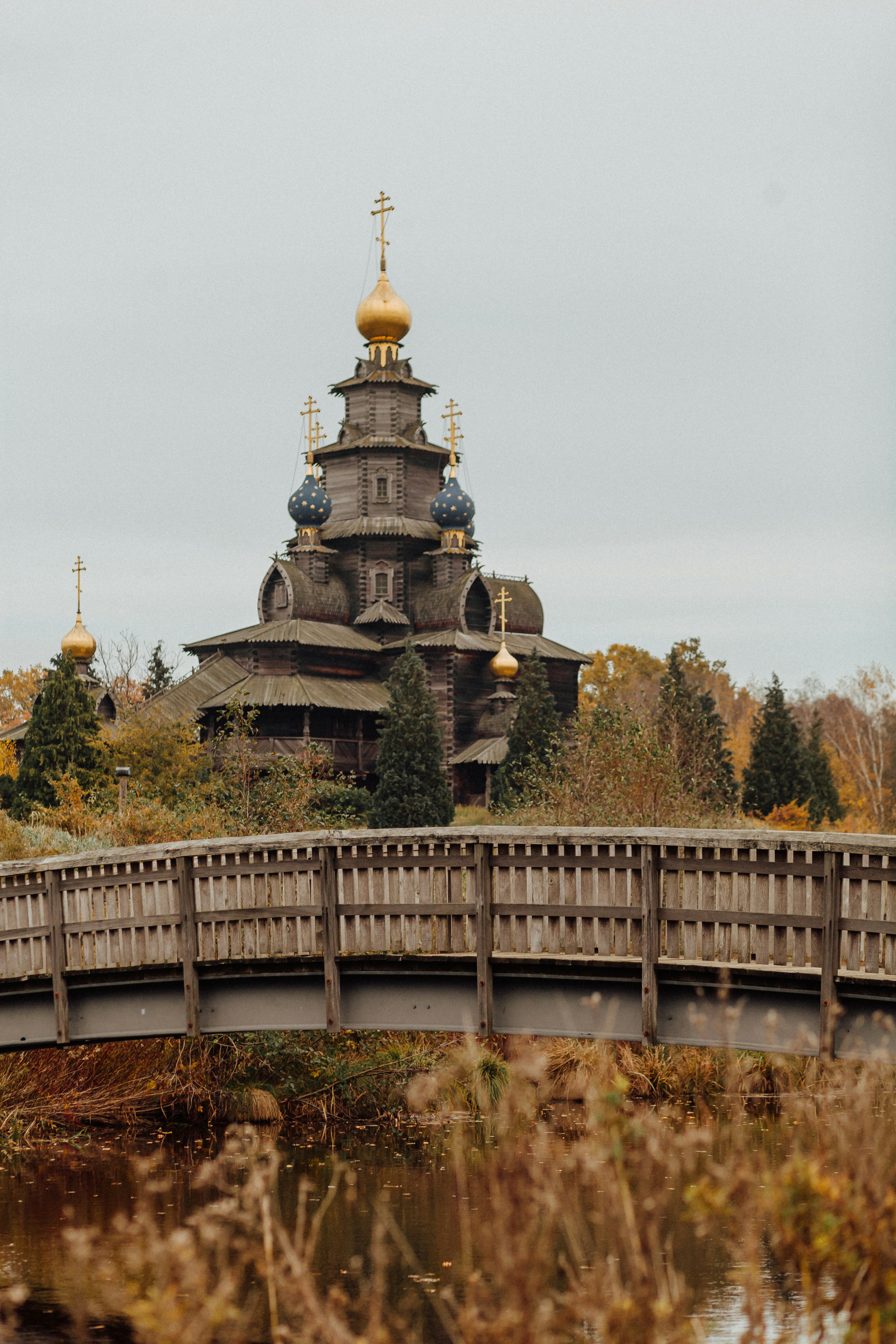 Timber Cathedral Above the River: Autumn Light on a Weathered Bridge