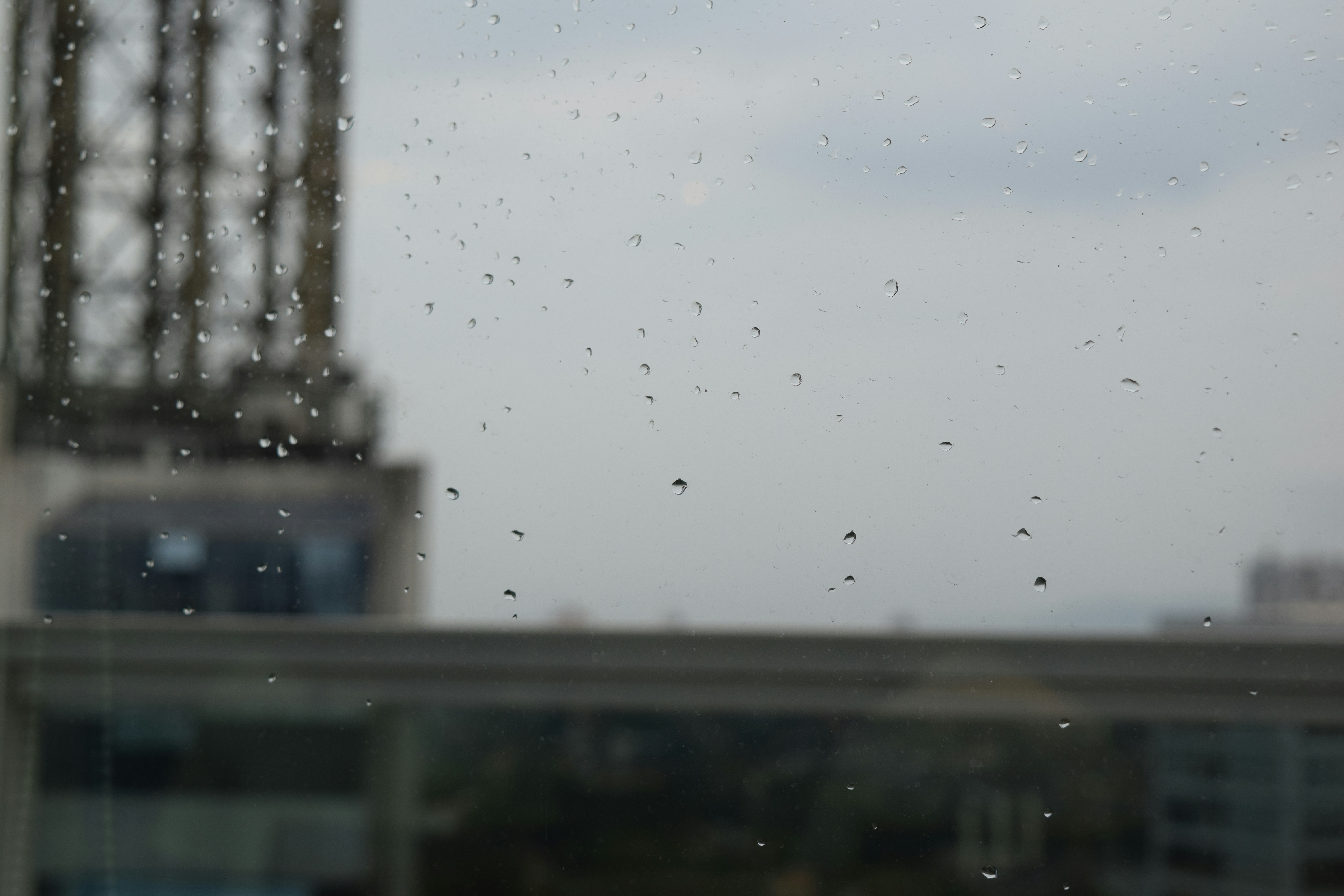 Rain-Splattered Glass: Soft-Focus City Behind the Blur