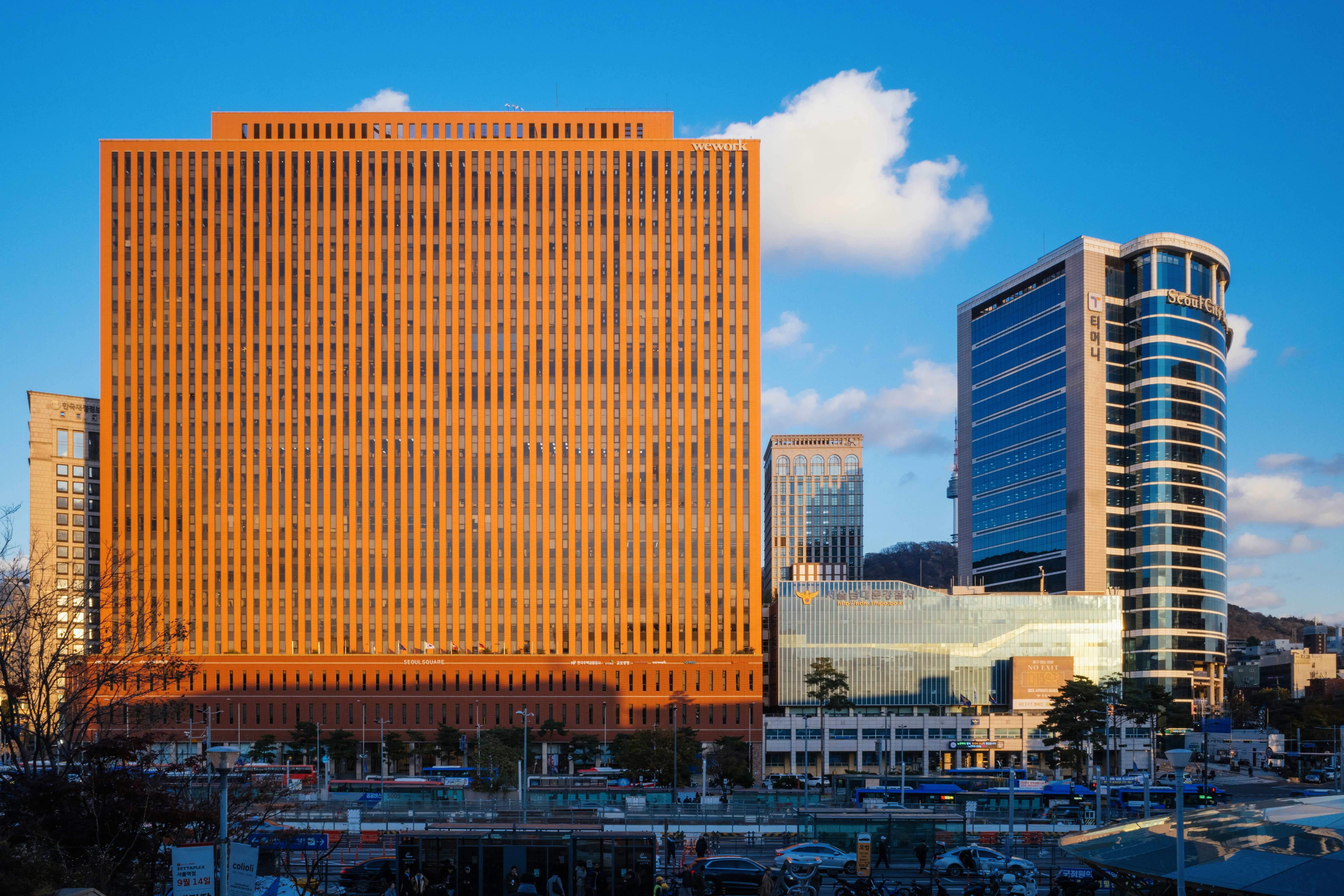 Copper Giant Over a Glassy Skyline by the Harbor