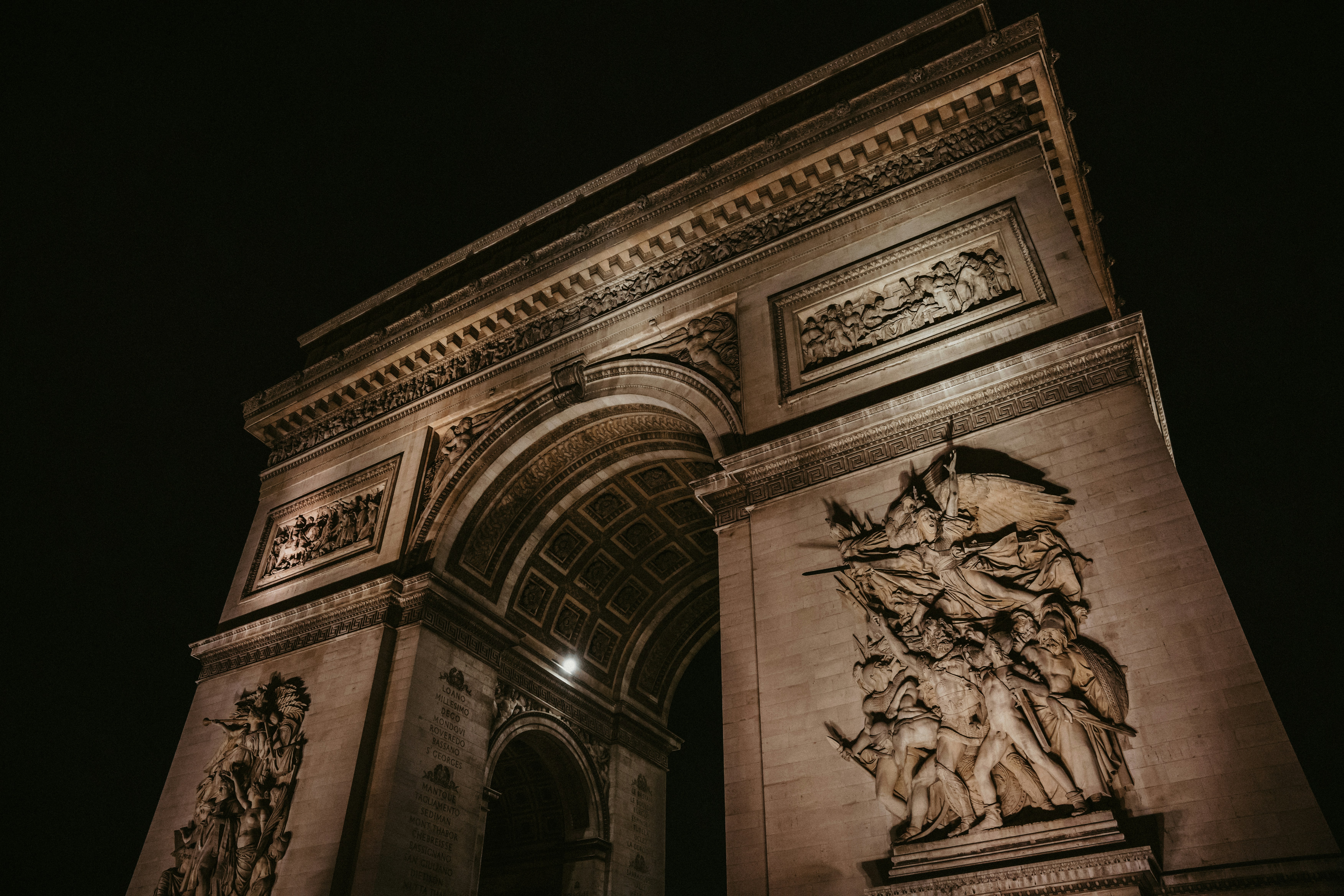 Archway in Night Light: Monumental Reliefs Brought to Life