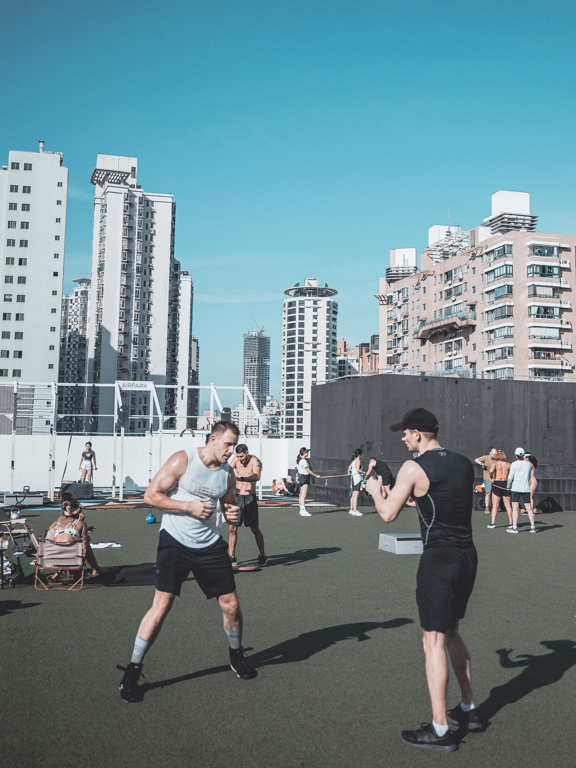 A group of people standing on top of a roof photo – Free Workout Image ...