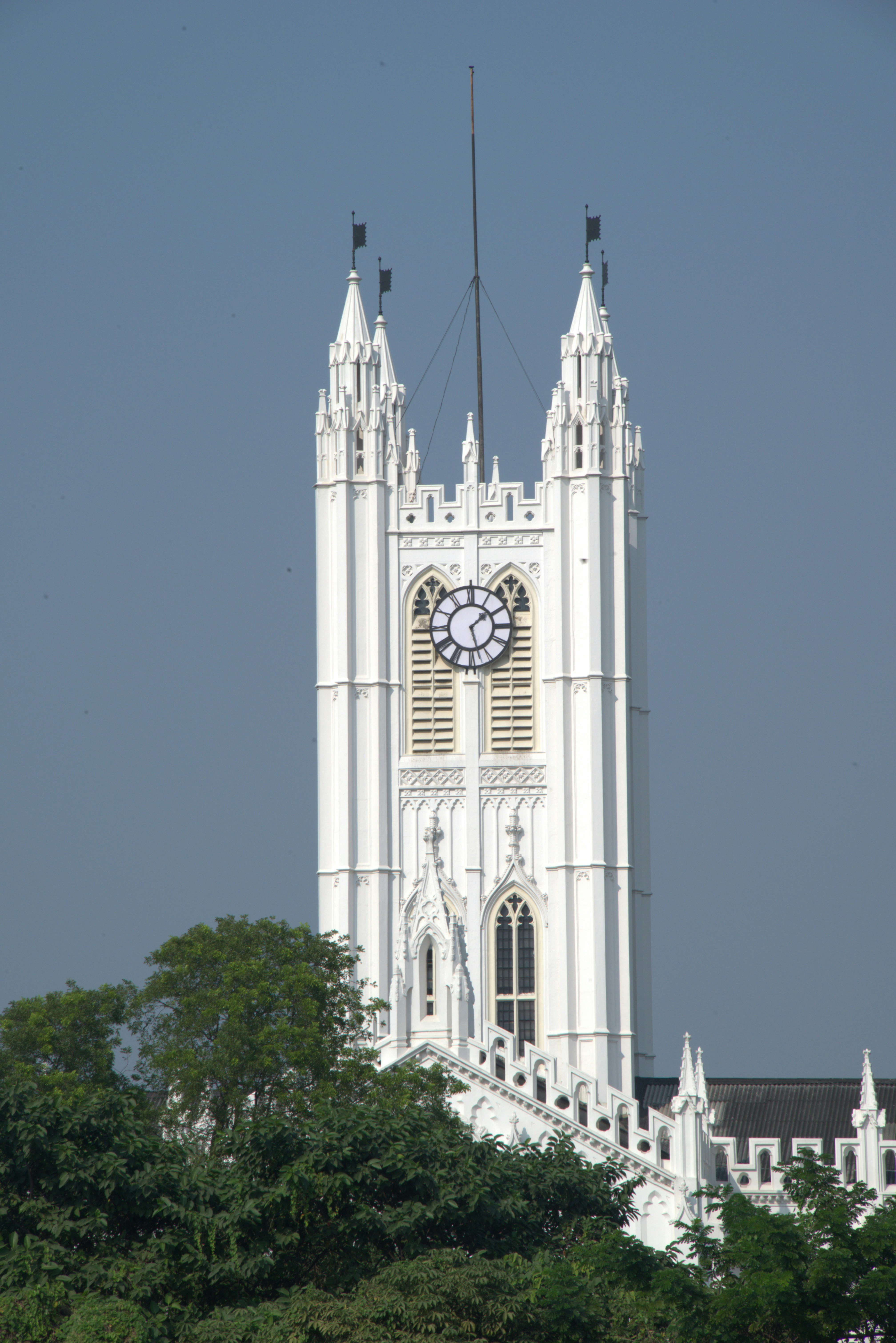 Ivory Gothic Clocktower Pierces the Clear Azure Sky