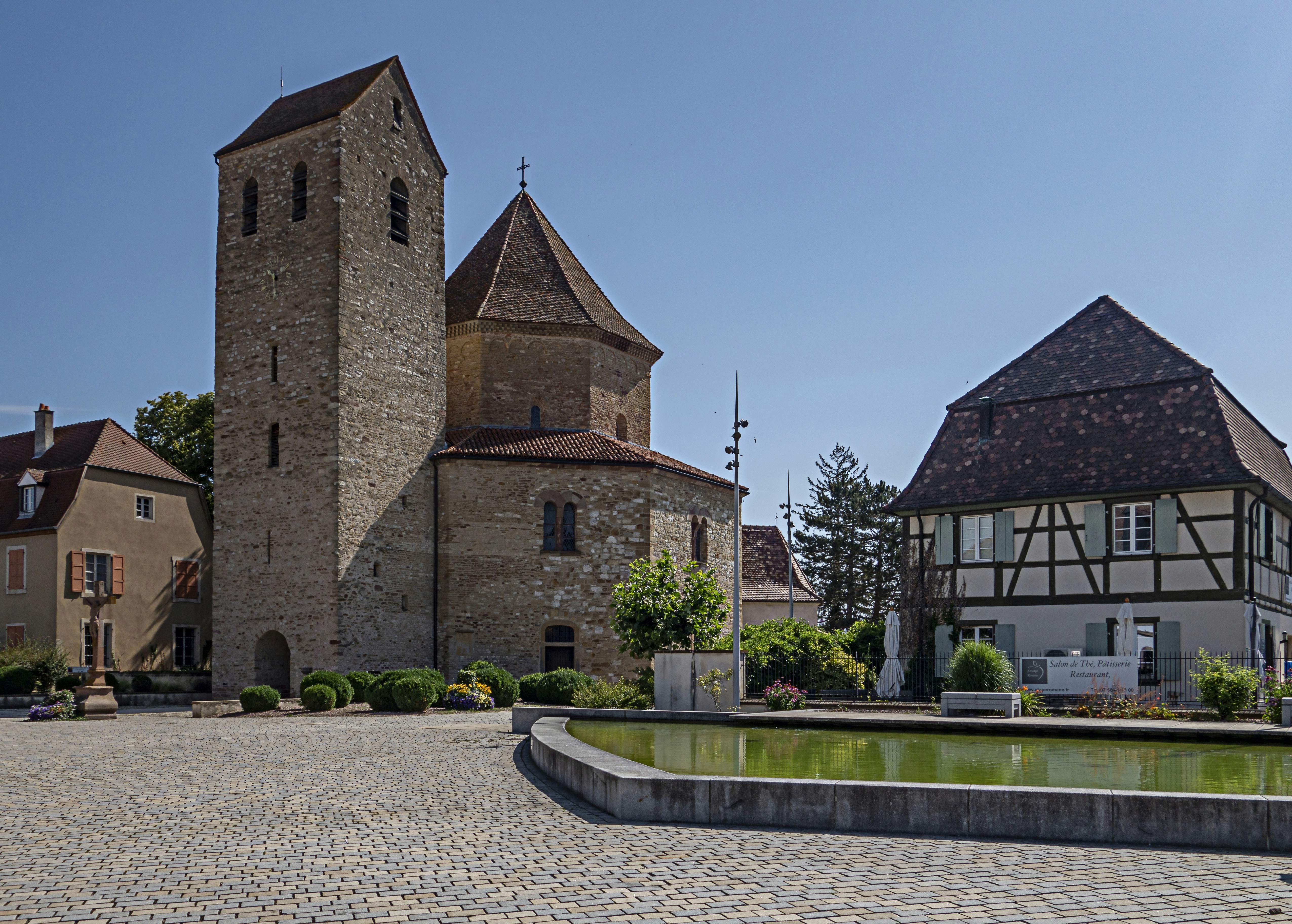 Sunlit Courtyard Between Tower and Timber-Framed House