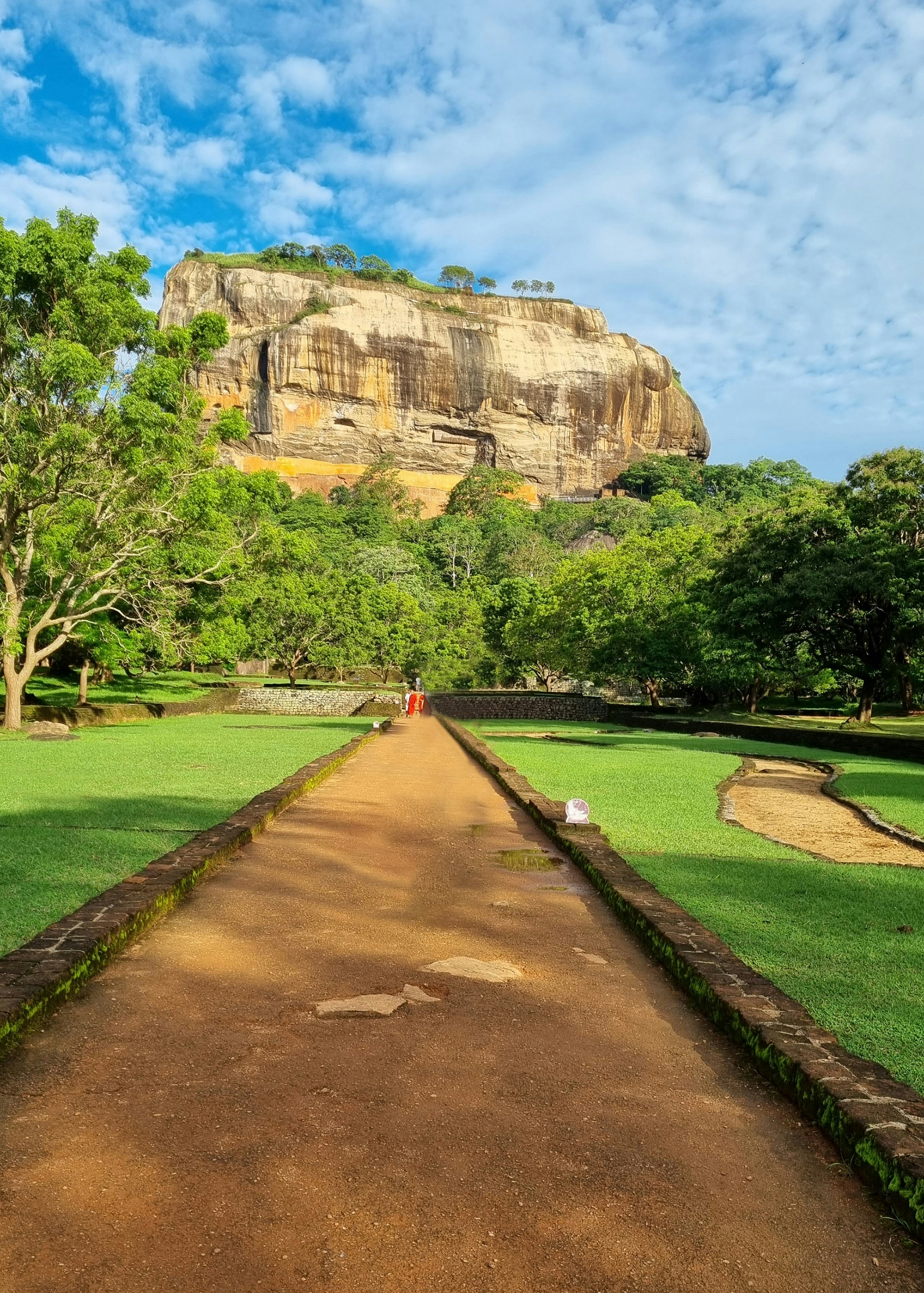 A dirt path leading to a large rock formation photo – Free Sri lanka ...