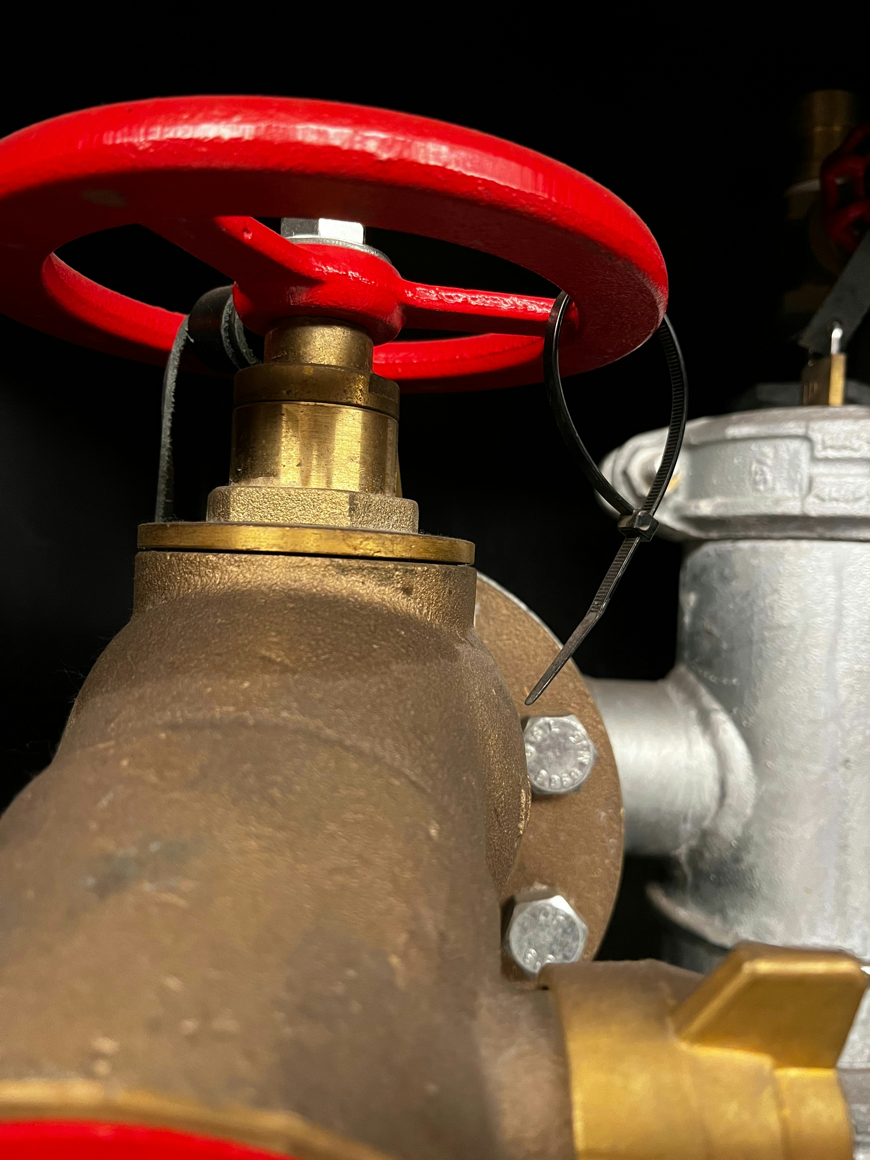 A close up of a red handle on a fire hydrant photo – Free Diamond Image ...