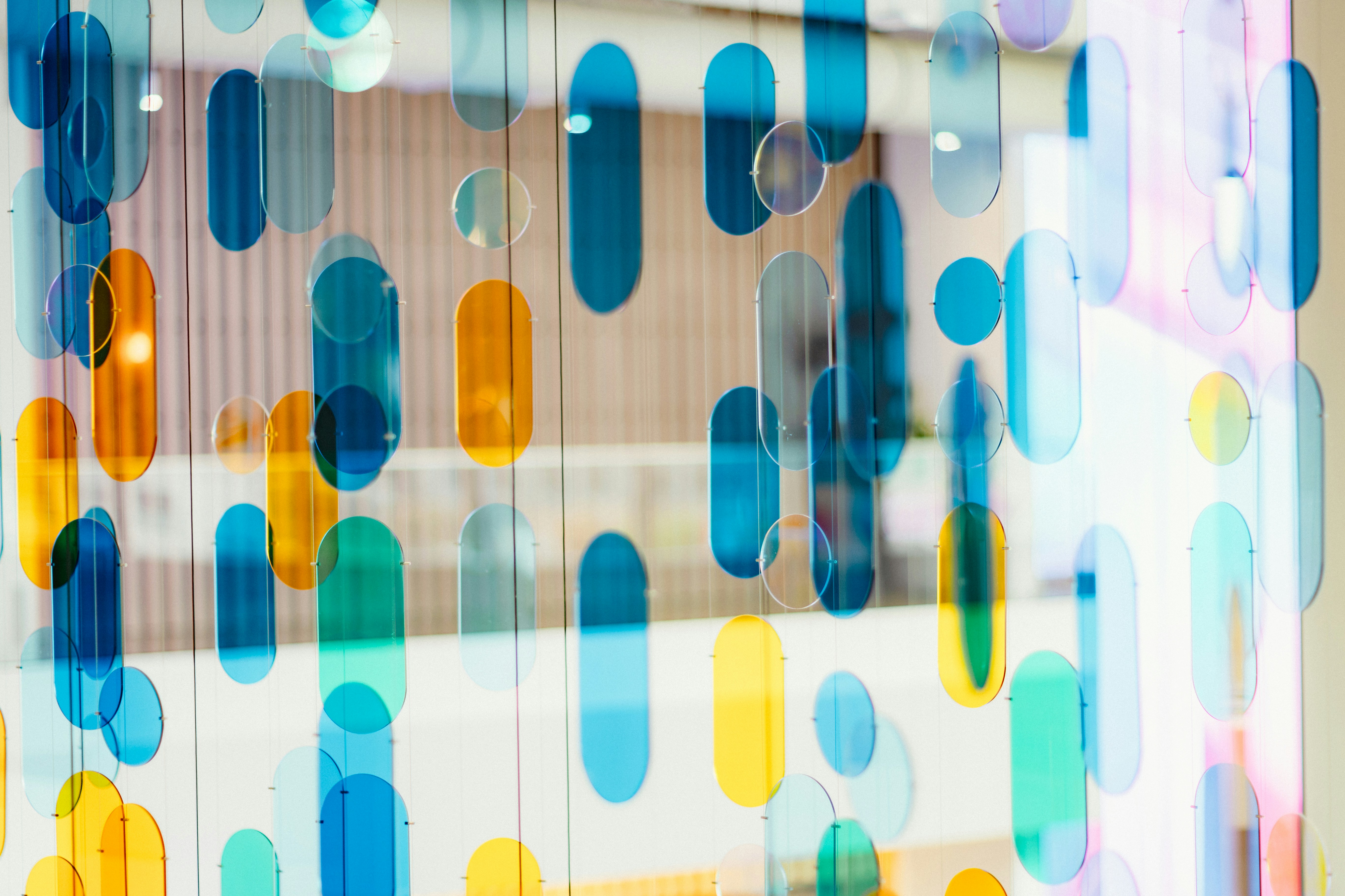 A close up of a window with colorful circles on it photo – Free ...