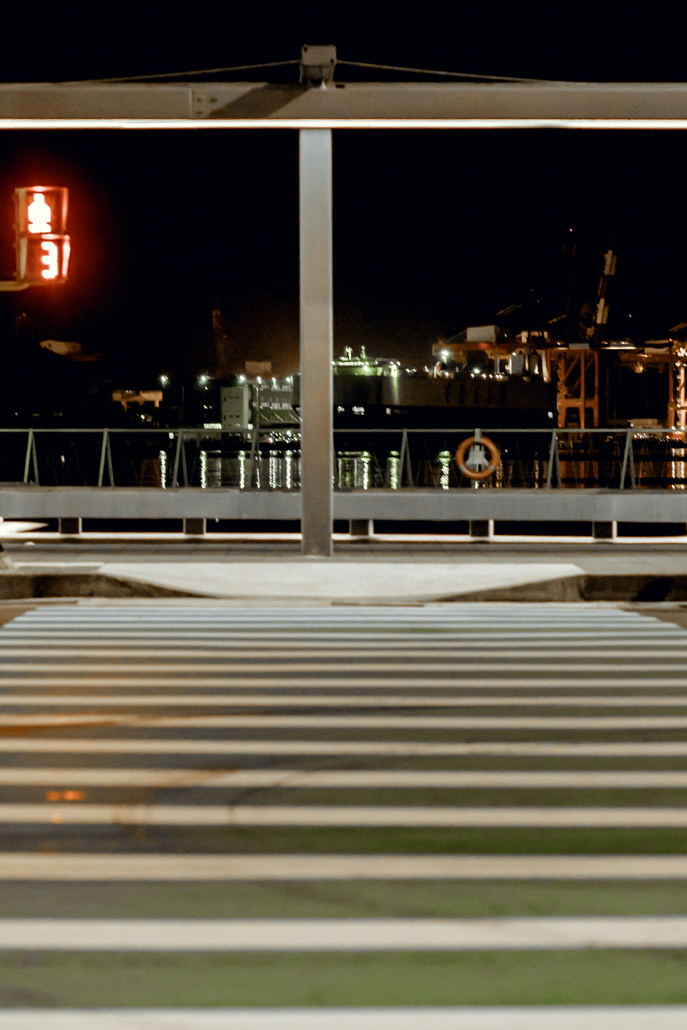 Neon Signal Over Night Harbor: Pier Lines Toward Distant Lights