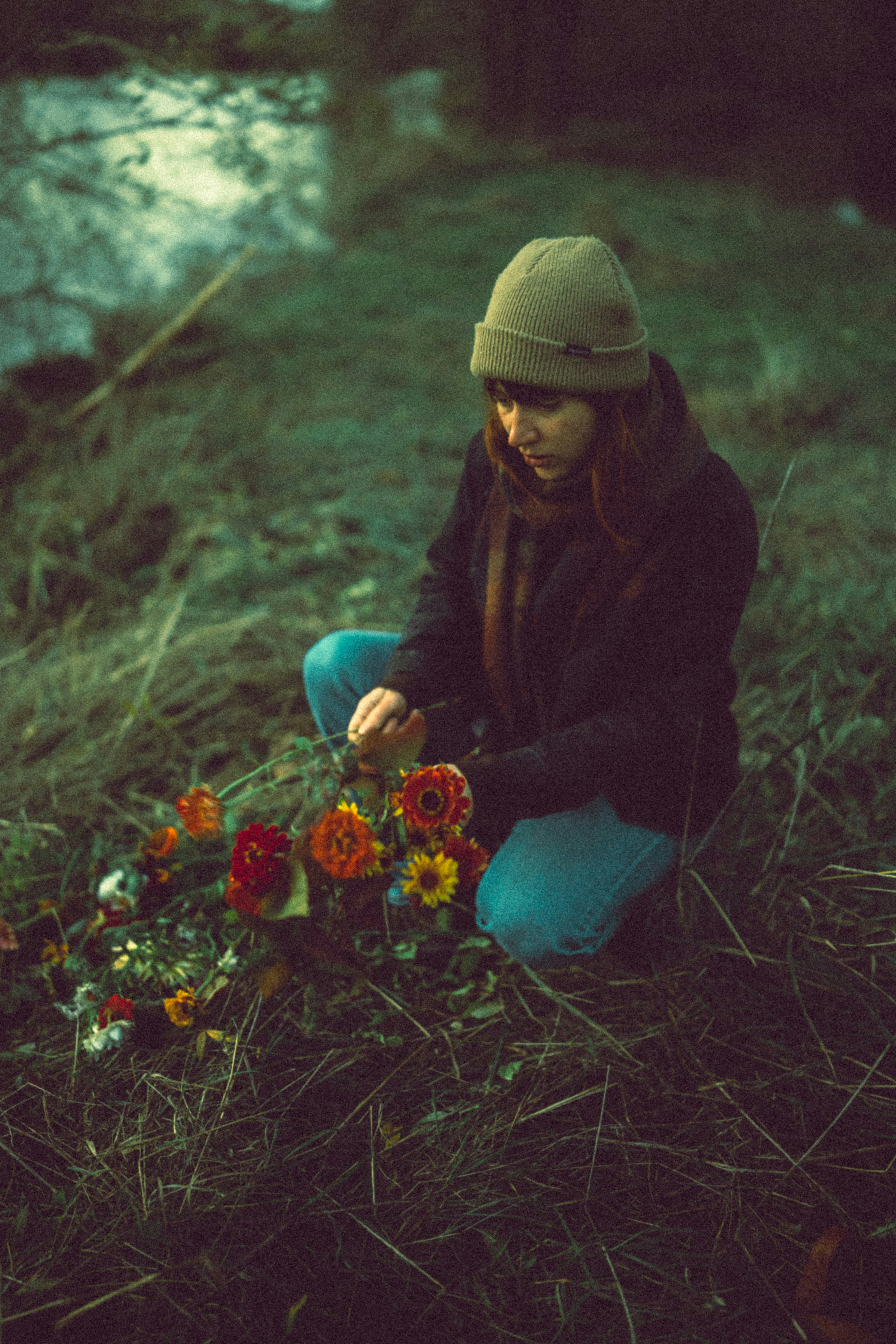 Harvest of Quiet Light: A Woman with Fresh Flowers in a Forest Clearing