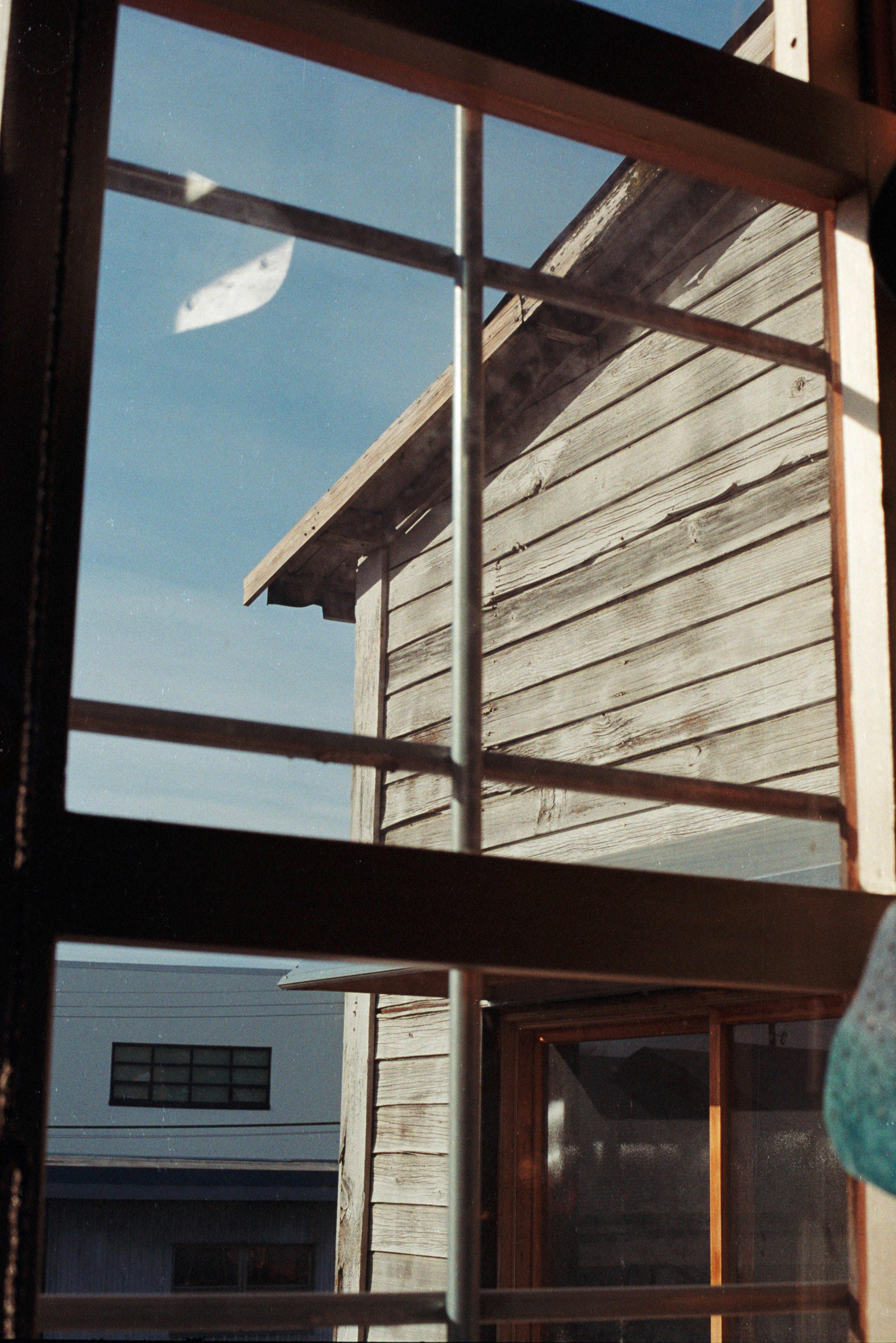 A view of a house through a window photo – Free Film Image on Unsplash