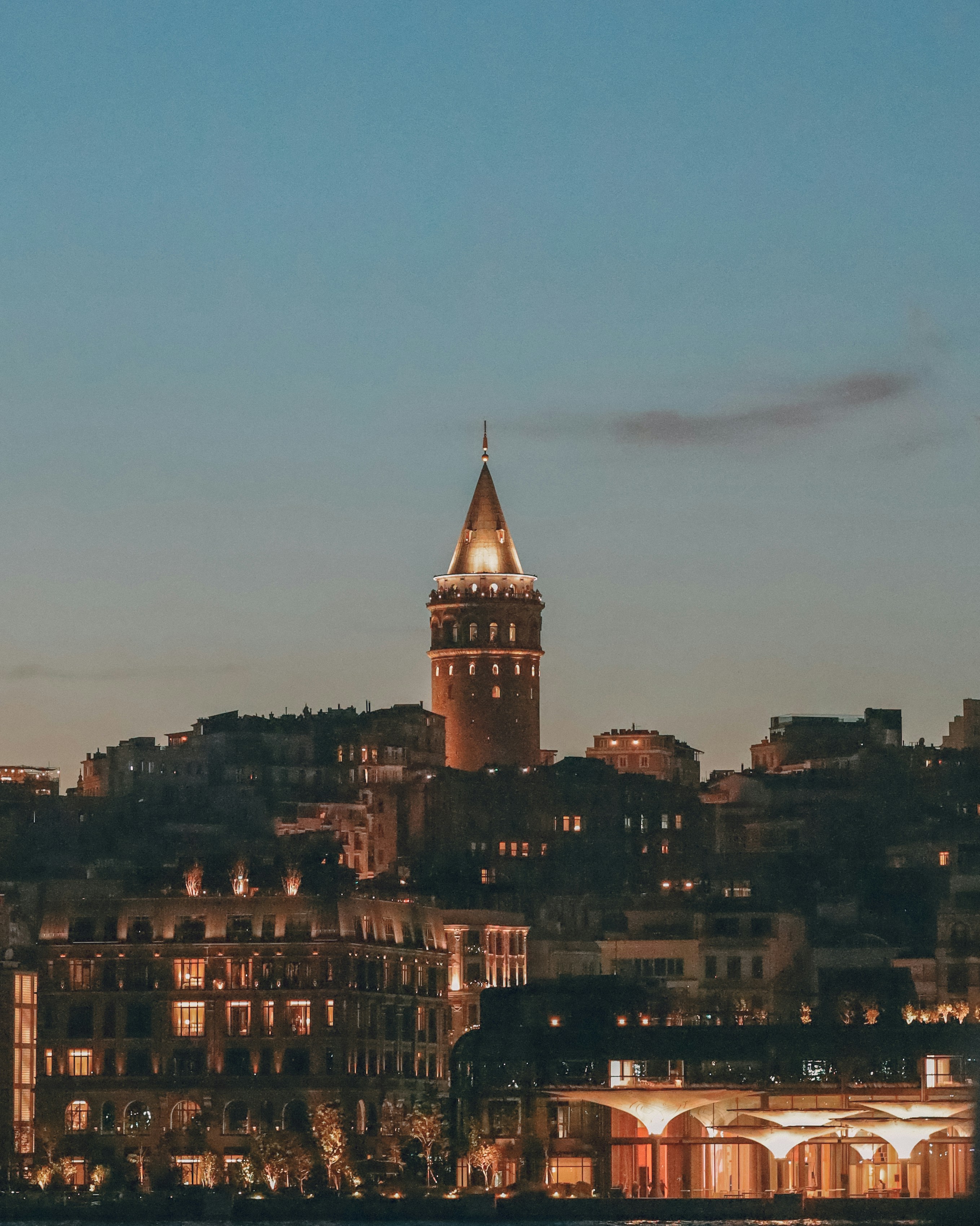 Evening Glow over Istanbul: Galata Tower Illuminates the Historic Skyline