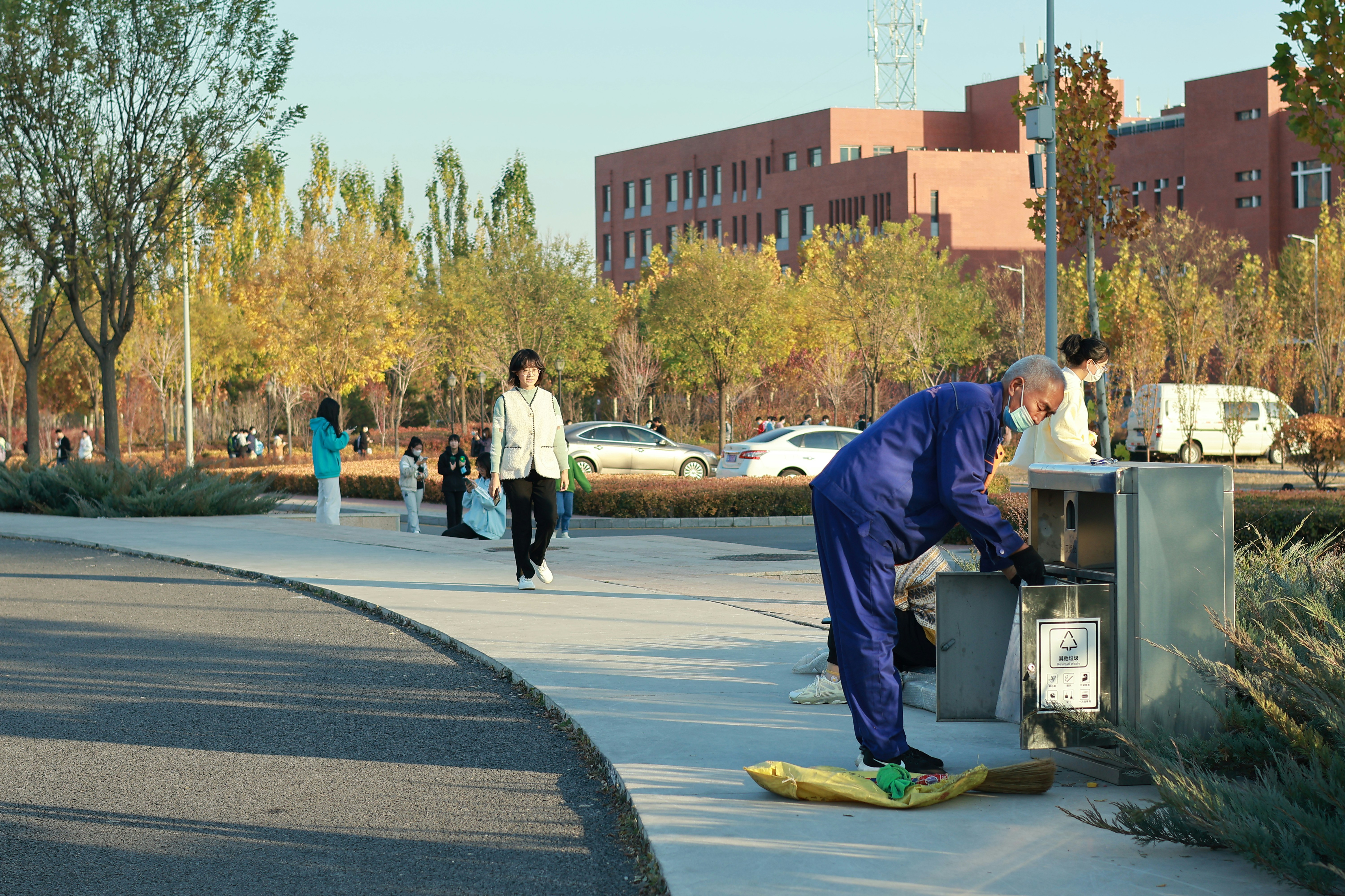 Blue Overalls at the Curve: a curbside moment under autumn trees