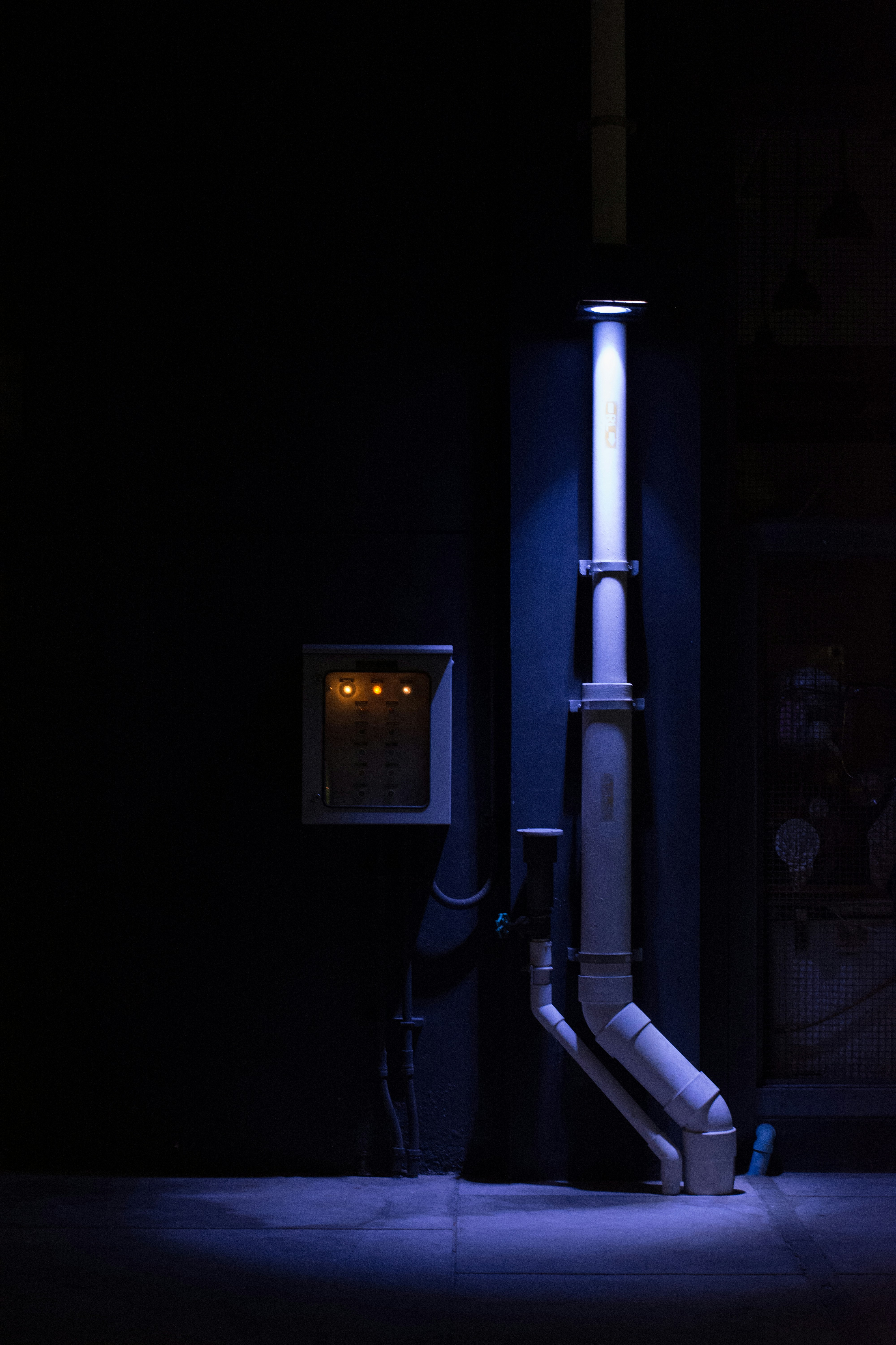 Midnight Conduit: A Lone Blue Pipeline Echoes Through Shadow