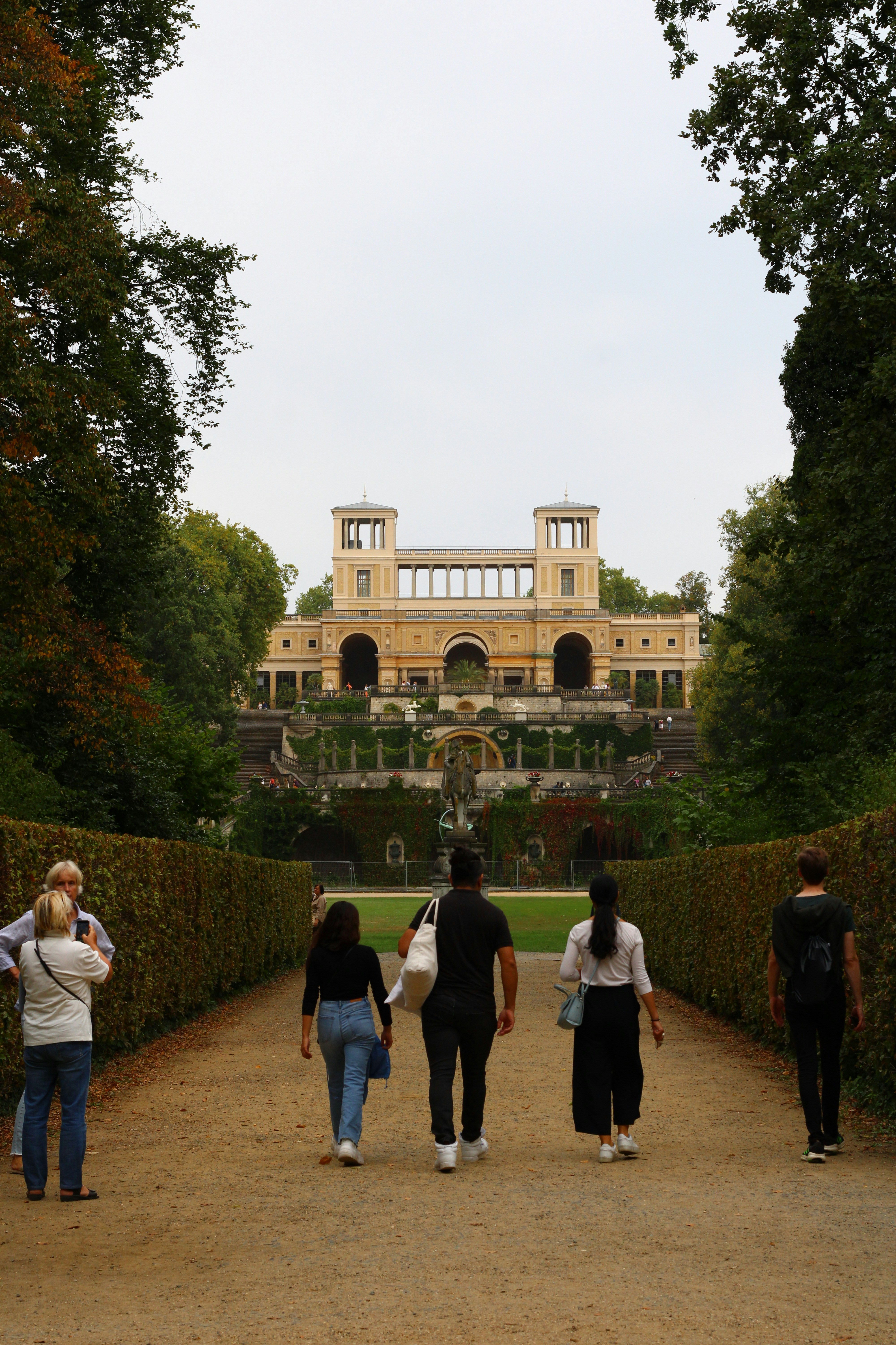 Grand Terrace Ascent: Visitors Approaching a Neoclassical Vista