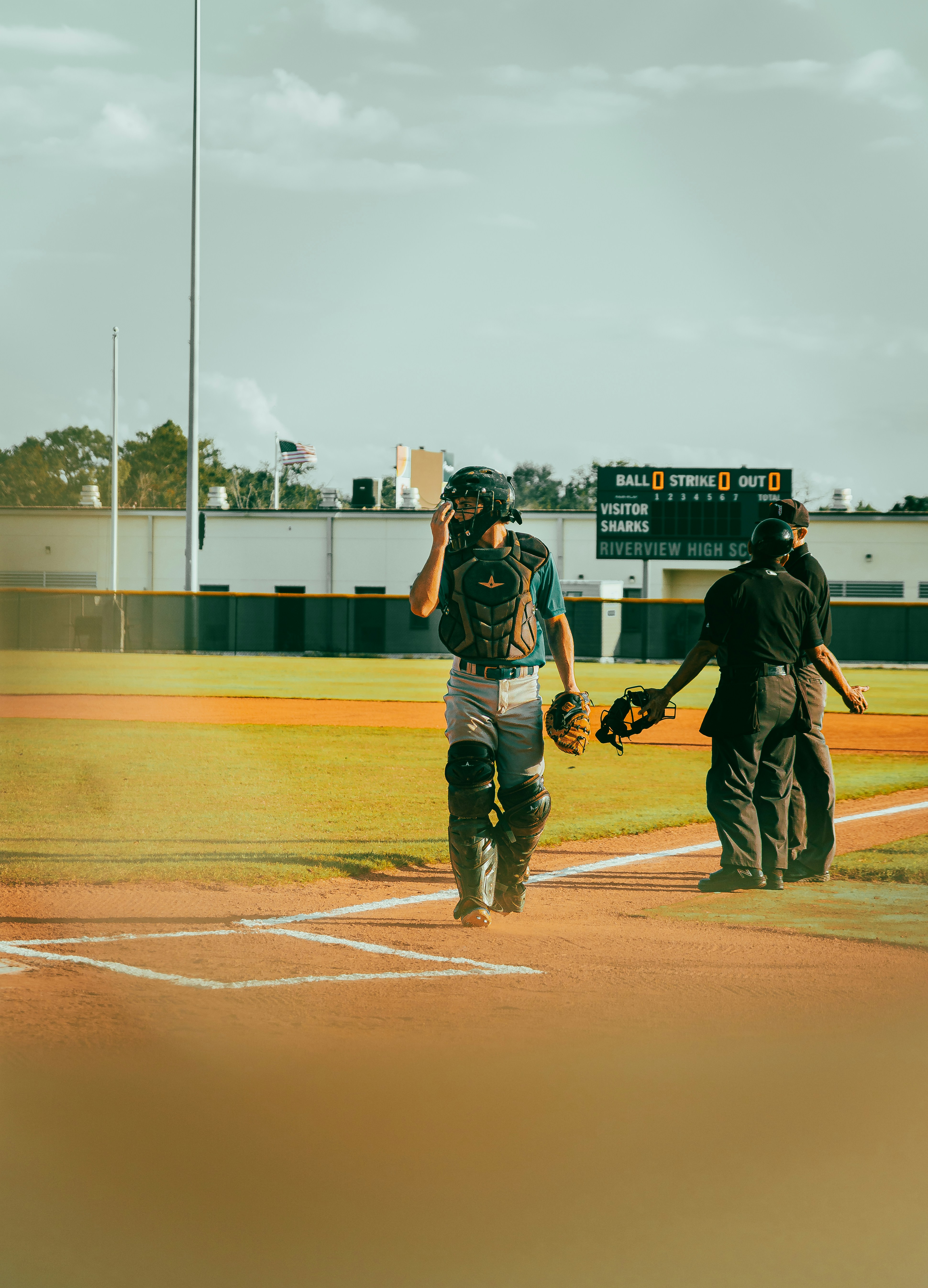 A baseball player walking across a baseball field photo – Free Baseball ...