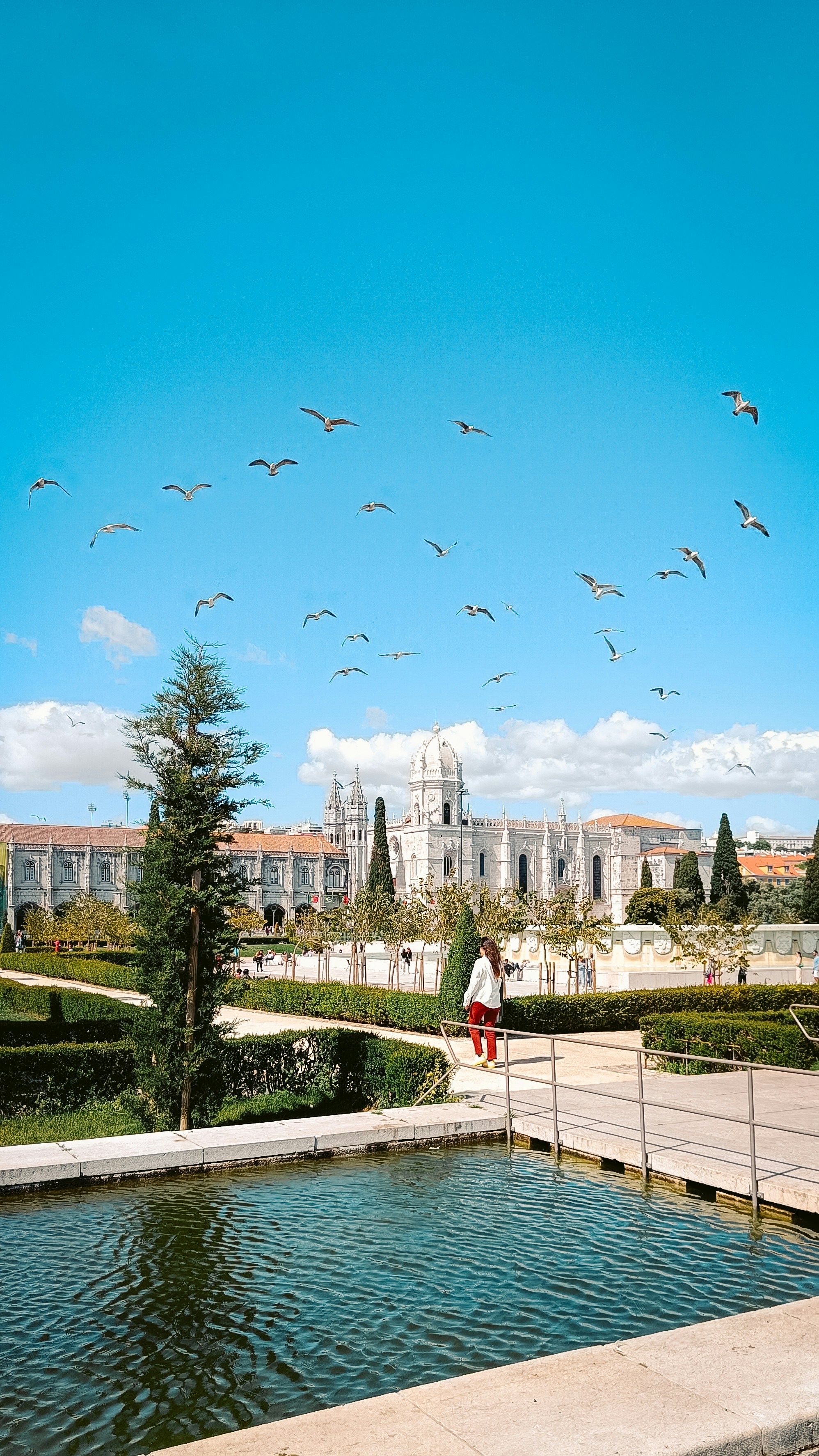 Winged Ensemble Over a Baroque Terrace by a Tranquil Canal