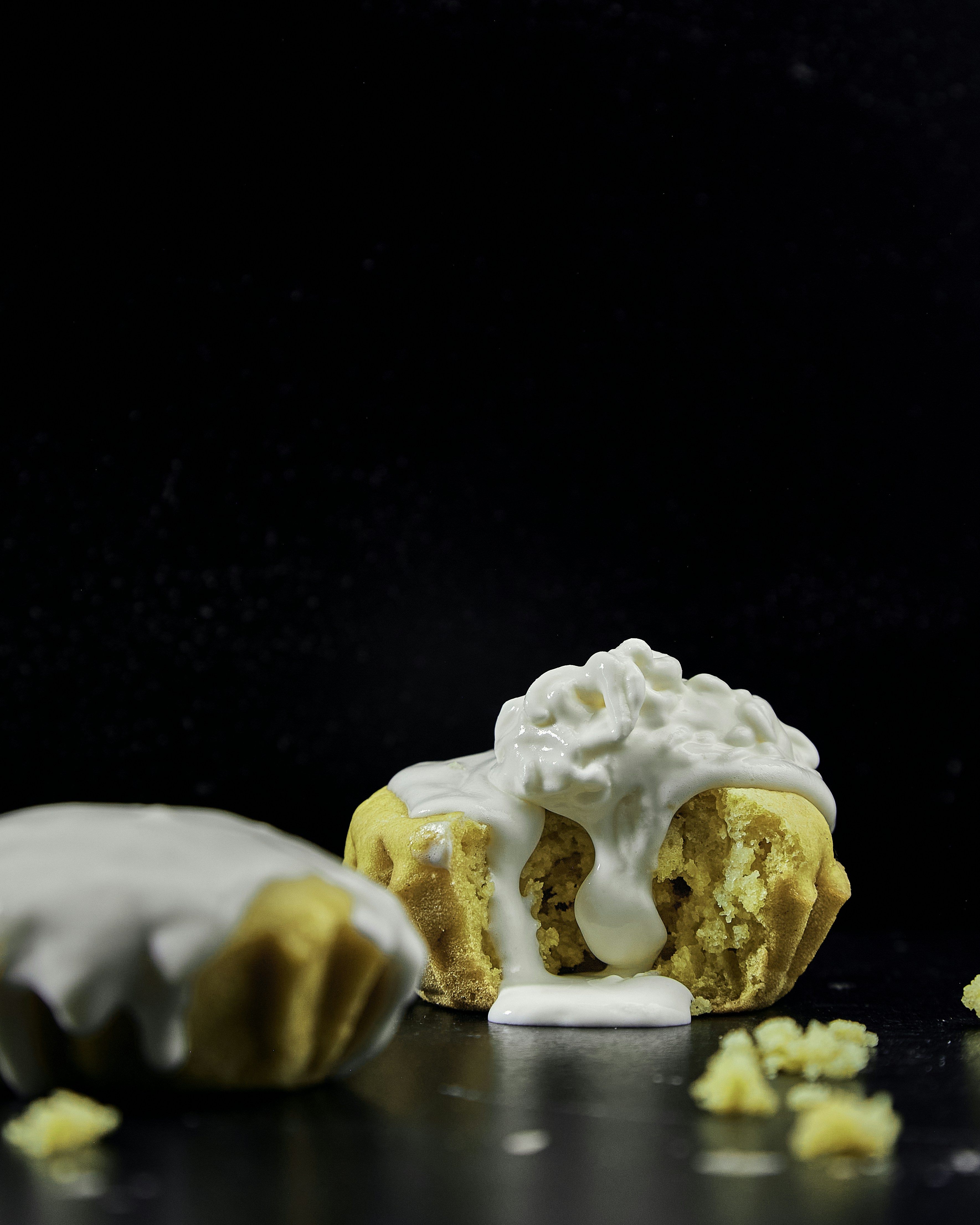 Melting Icing on a Golden Pastry in a Velvet Black Studio