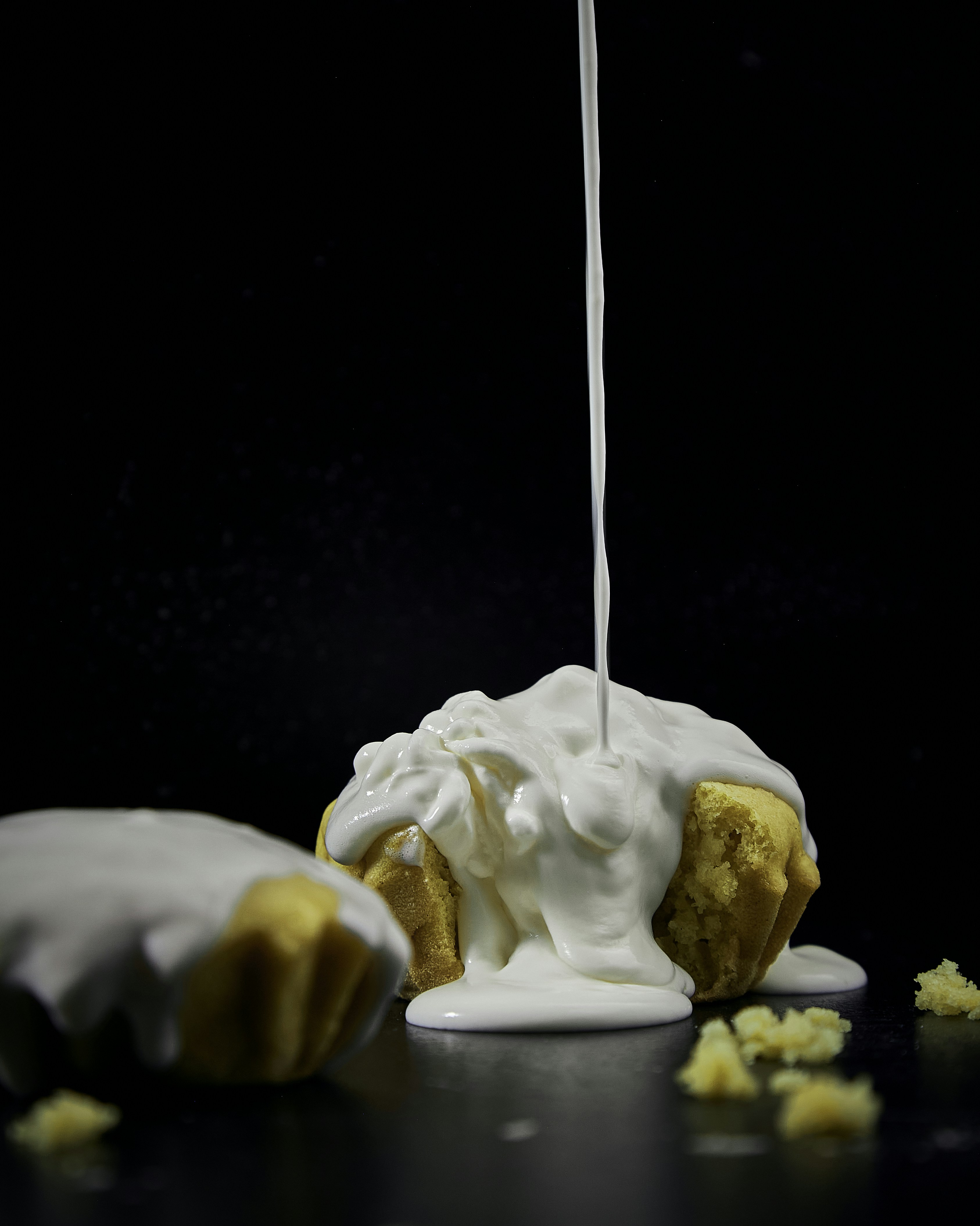 A piece of cake is being drizzled with icing photo – Free Food Image on ...