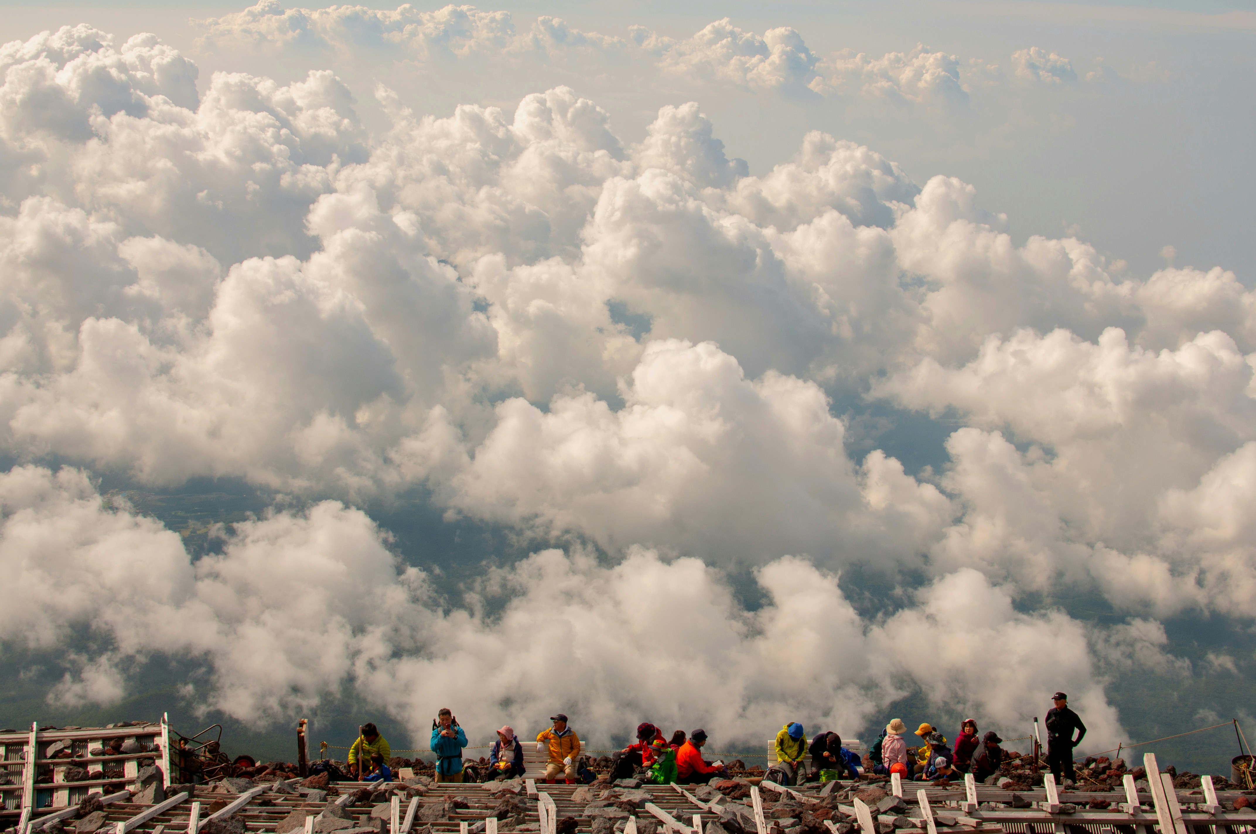 Ridge of Hope: Climbers Rest at the Cloud-Sea Summit