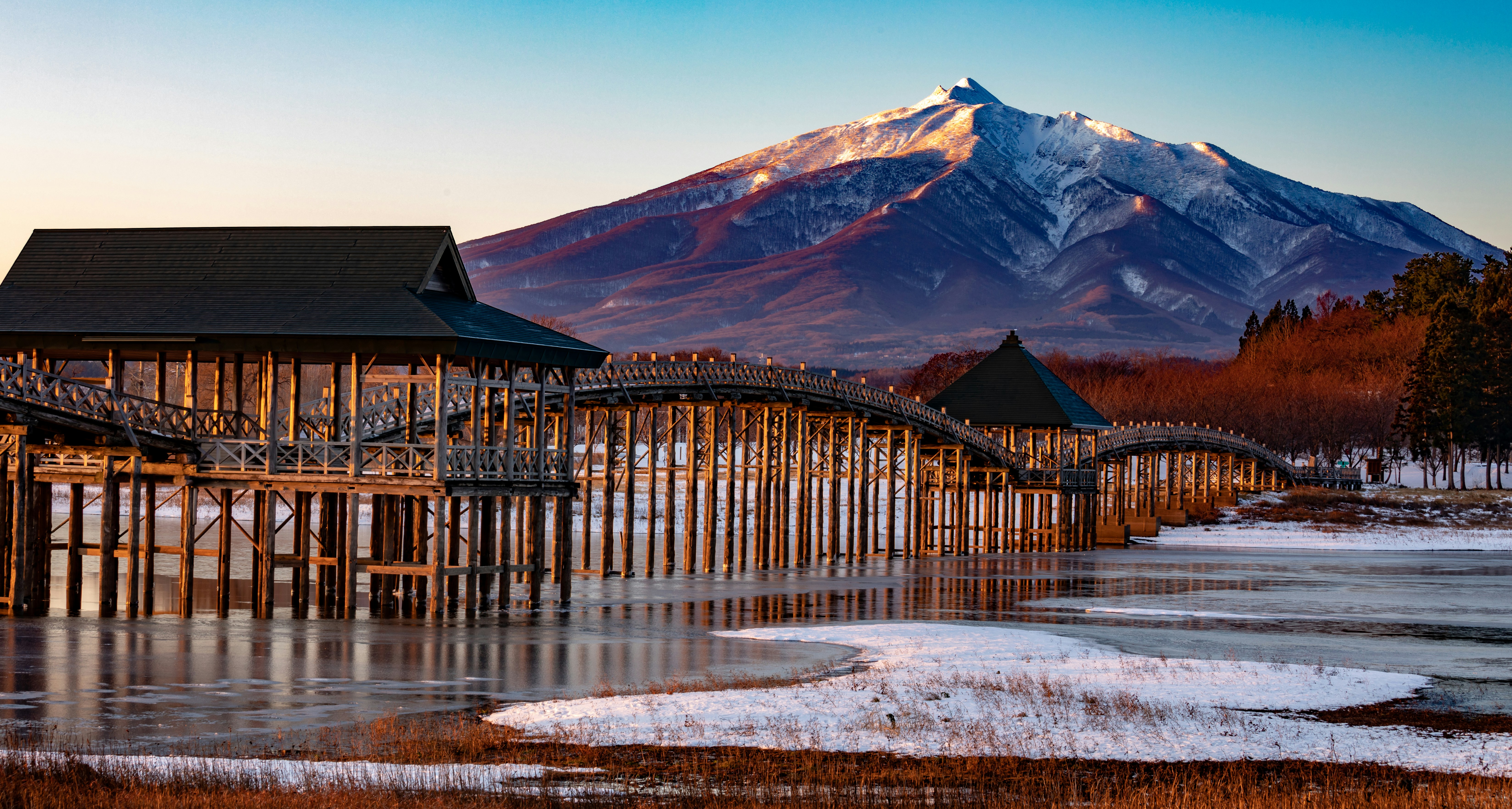 A wooden pier with a mountain in the background photo – Free Aomori in ...