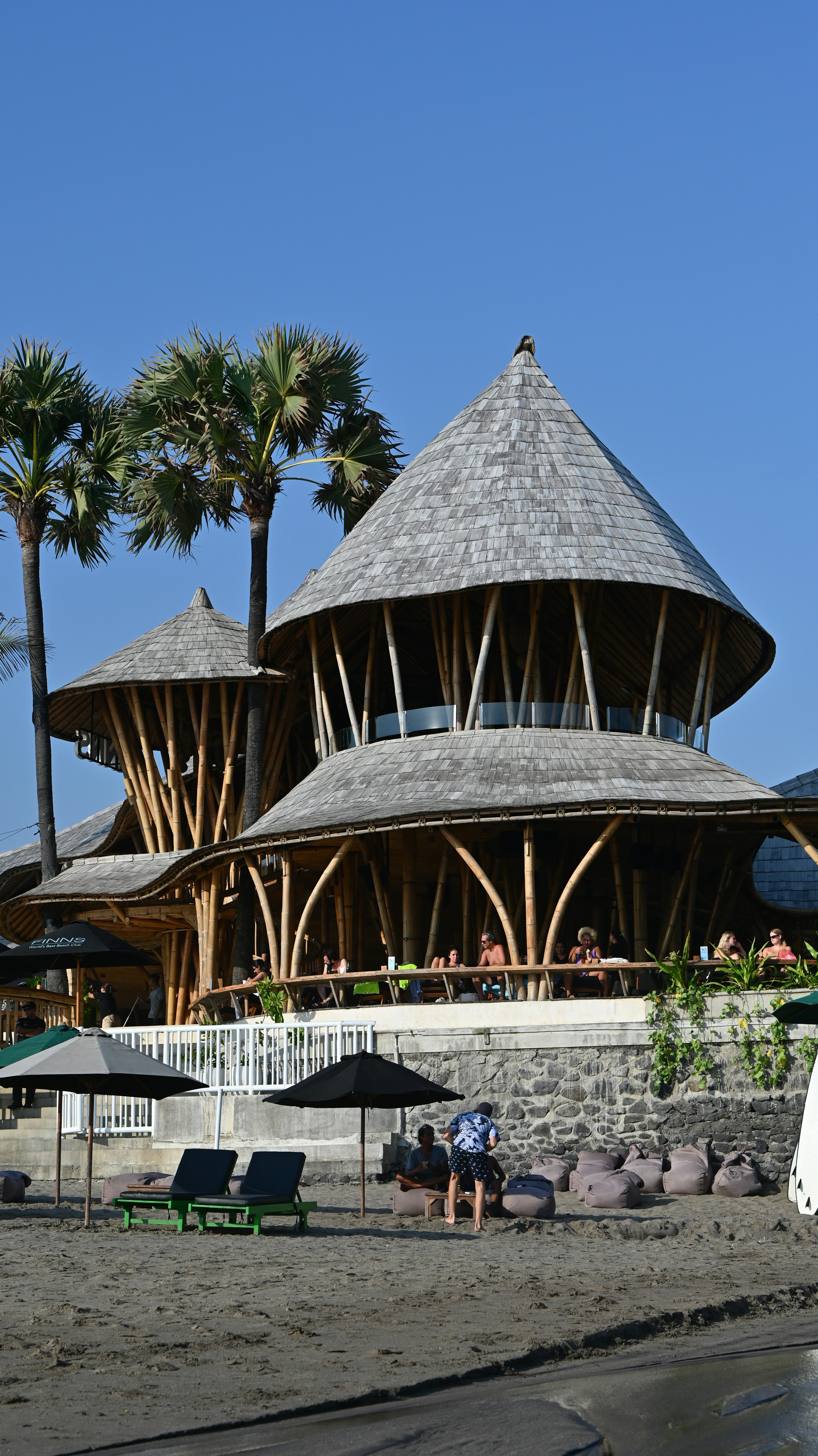 Beachtop Pavilion: Thatch, Bamboo, and Palm Lines on a Sunlit Shore