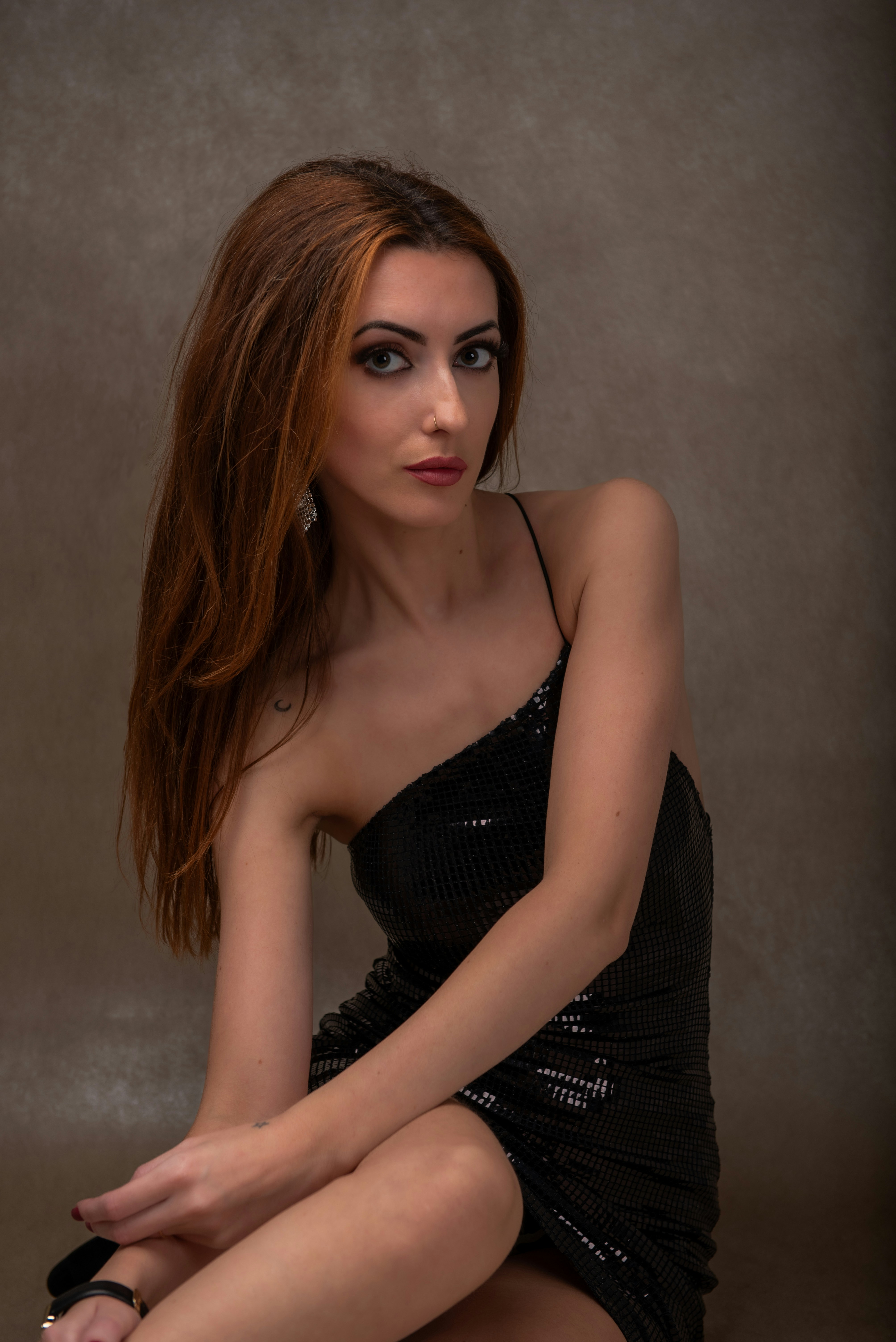 A woman in a black dress posing for a picture photo – Free Norwich ...