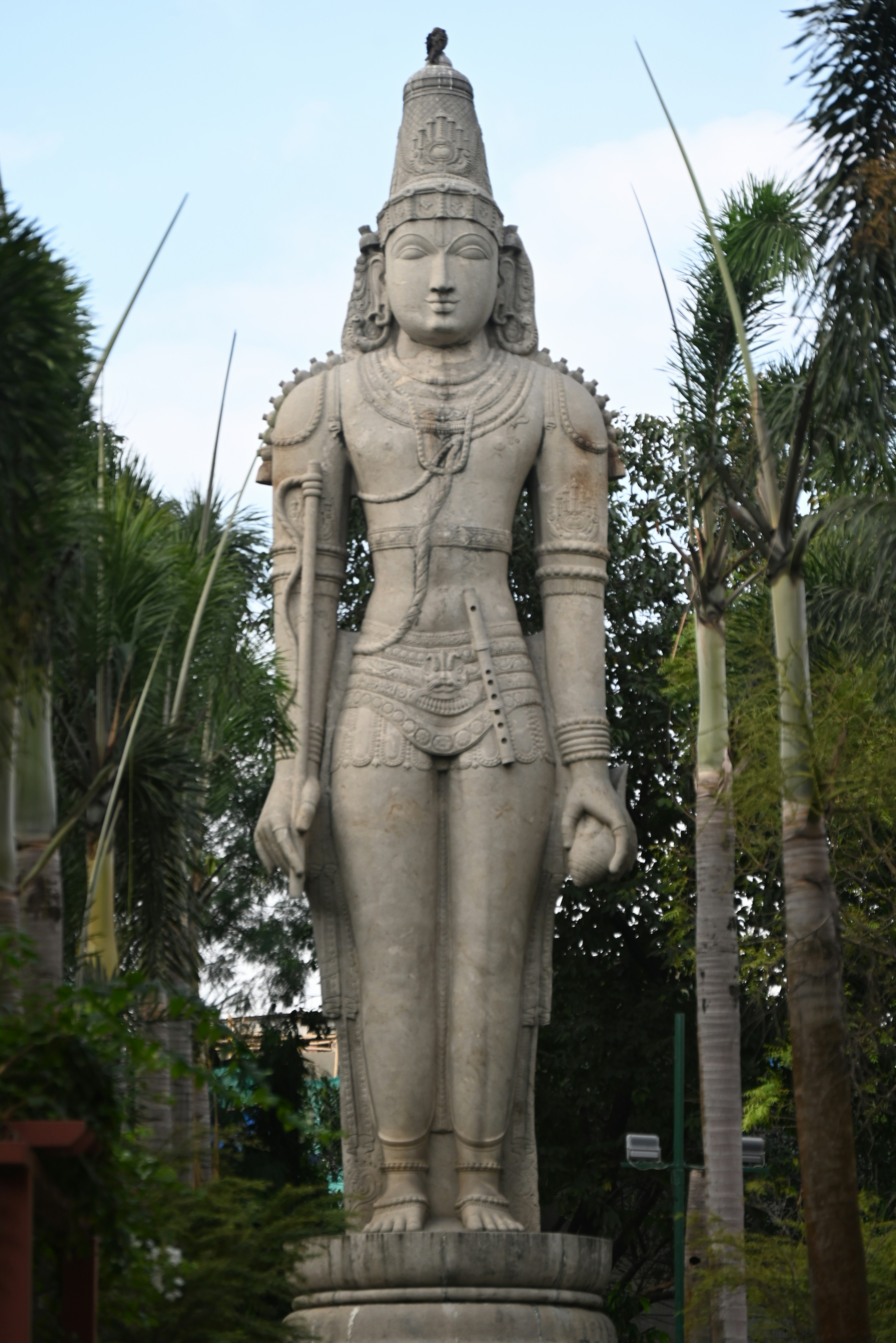 Ancient Guardian in a Palm-Fringed Garden