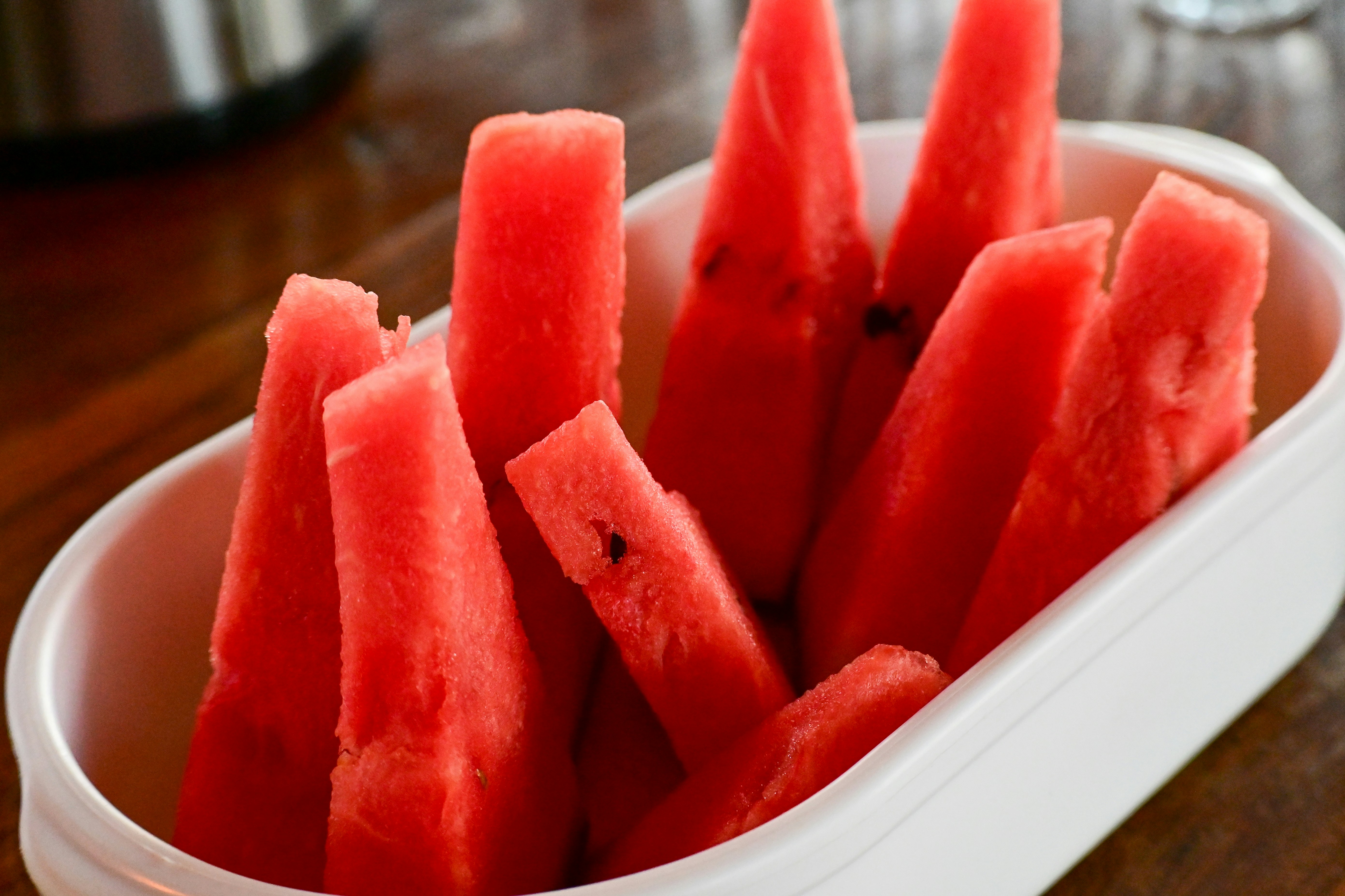 A white bowl filled with slices of watermelon photo – Free Fruit Image ...