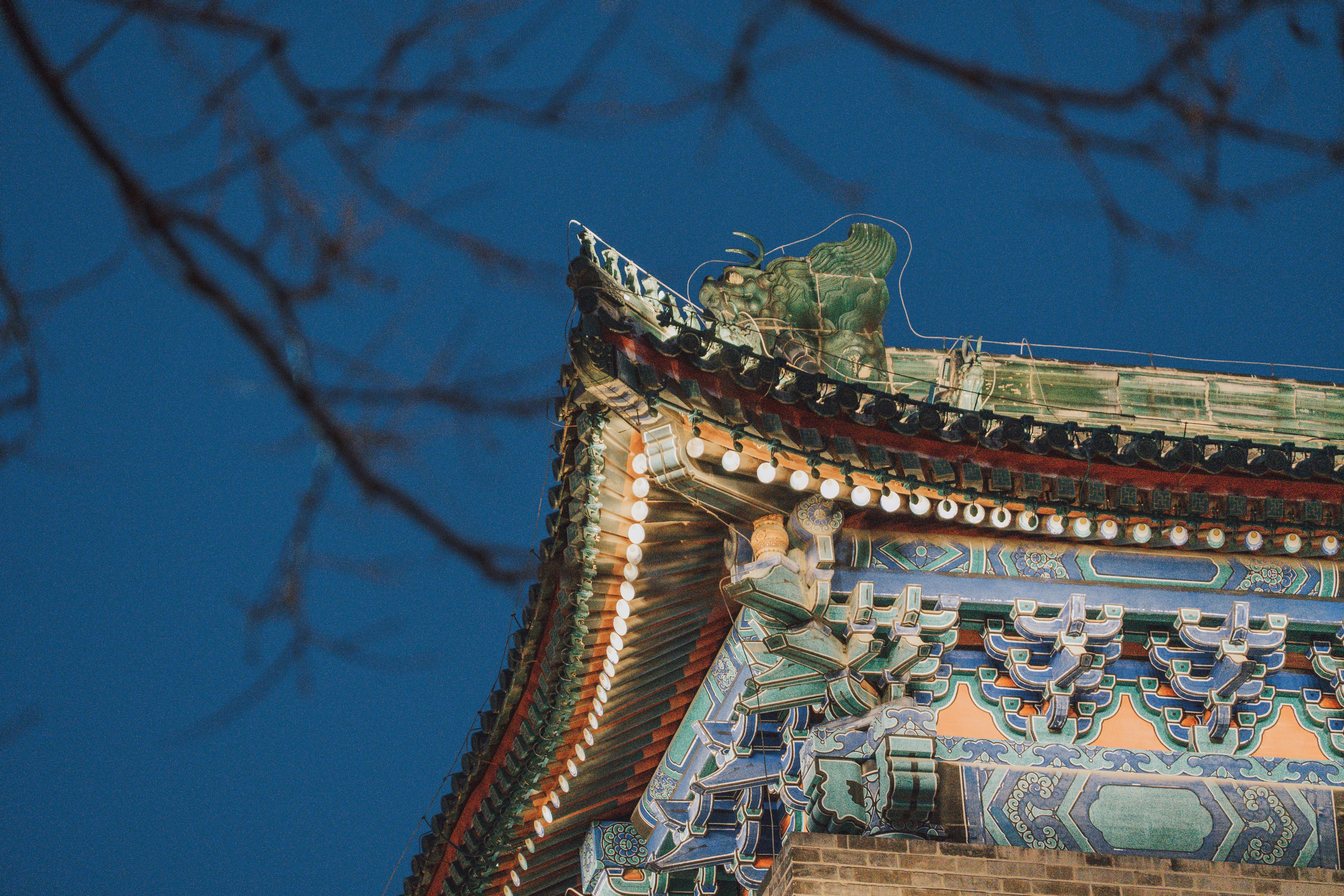 a tall building with a dragon on top of it