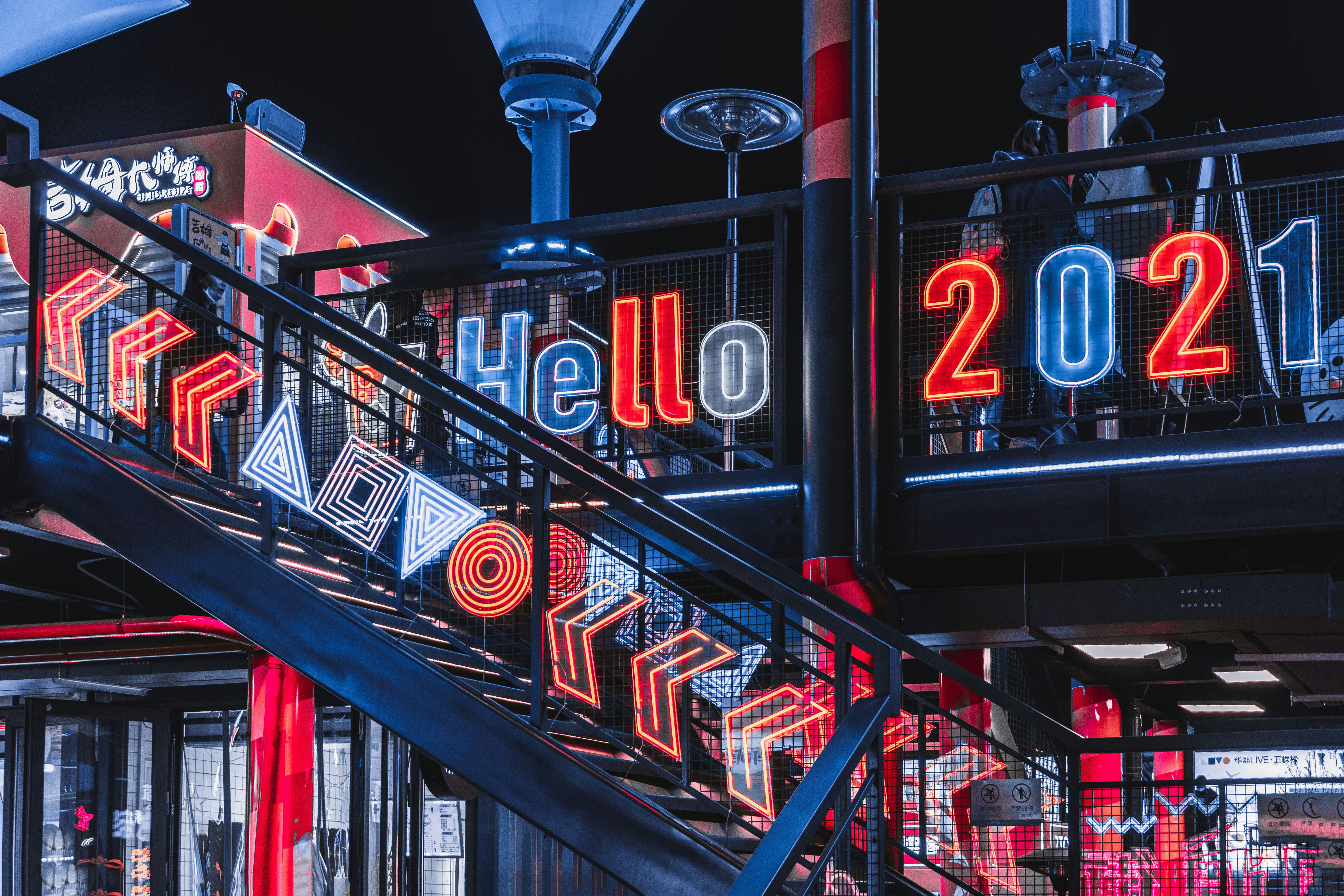 A set of stairs in a building with neon signs photo – Free Beijing ...
