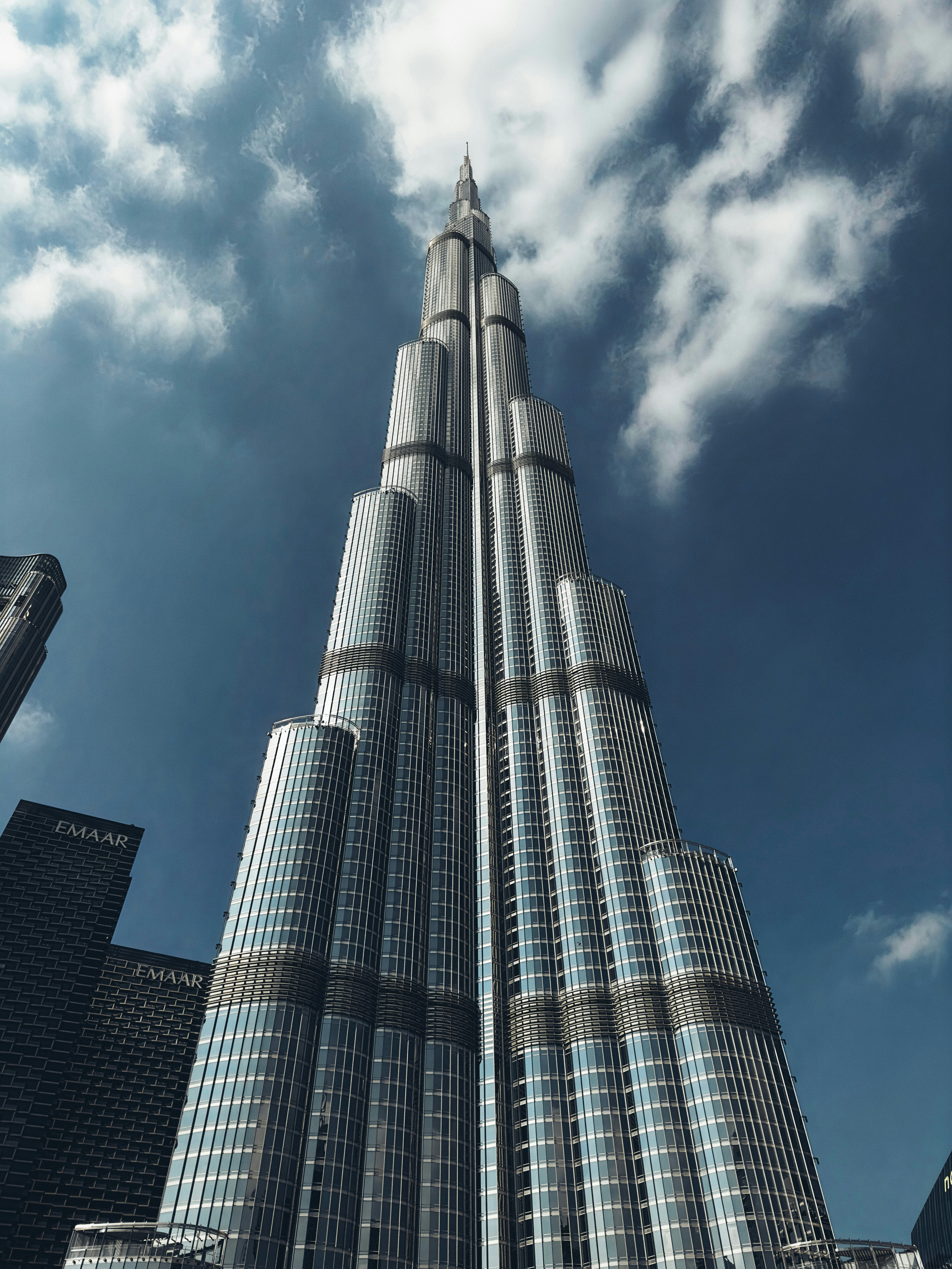 A very tall building towering into the sky photo – Free Grey Image on ...