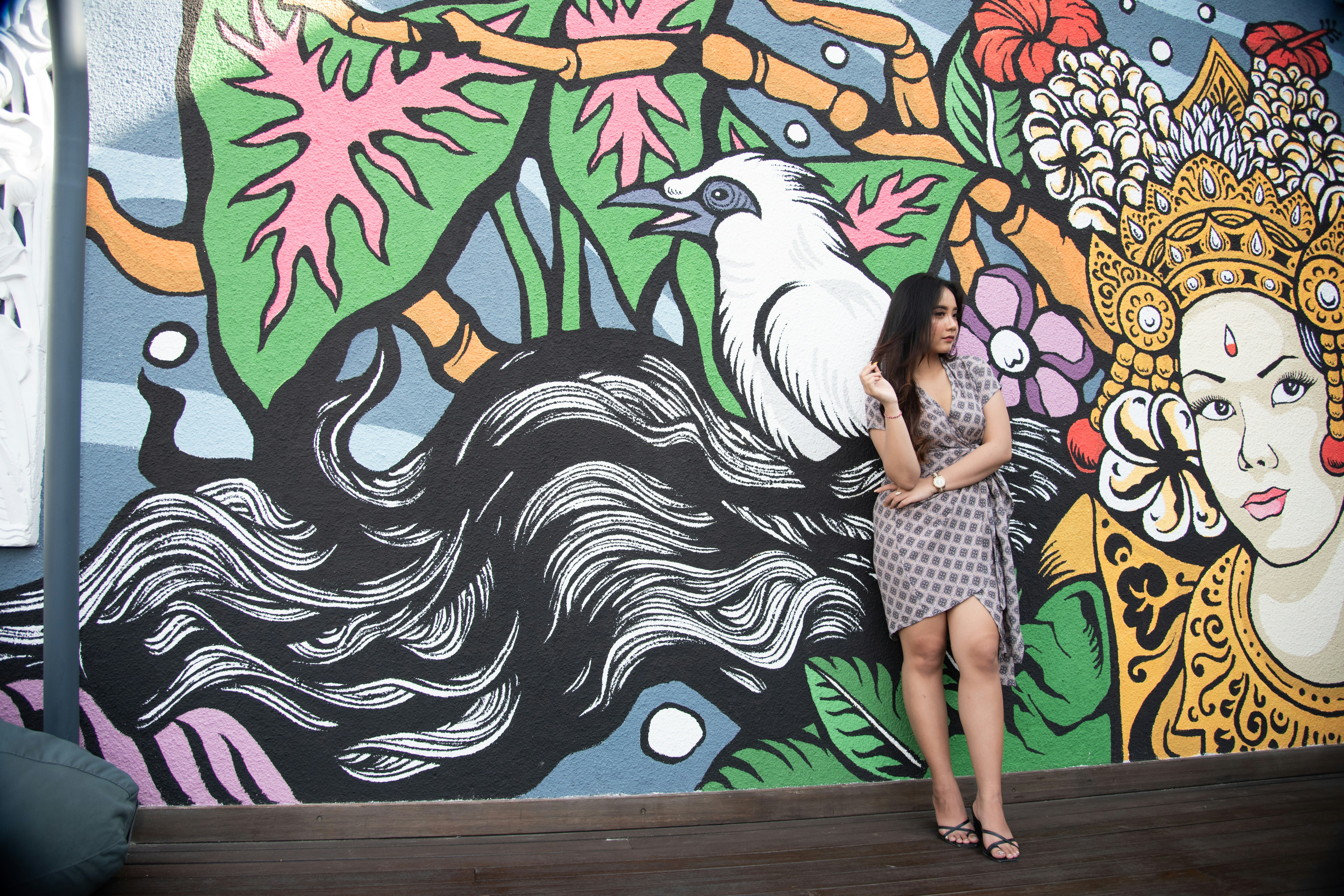 Portrait in a Graffiti Tapestry: A Woman Among Colorful Myths