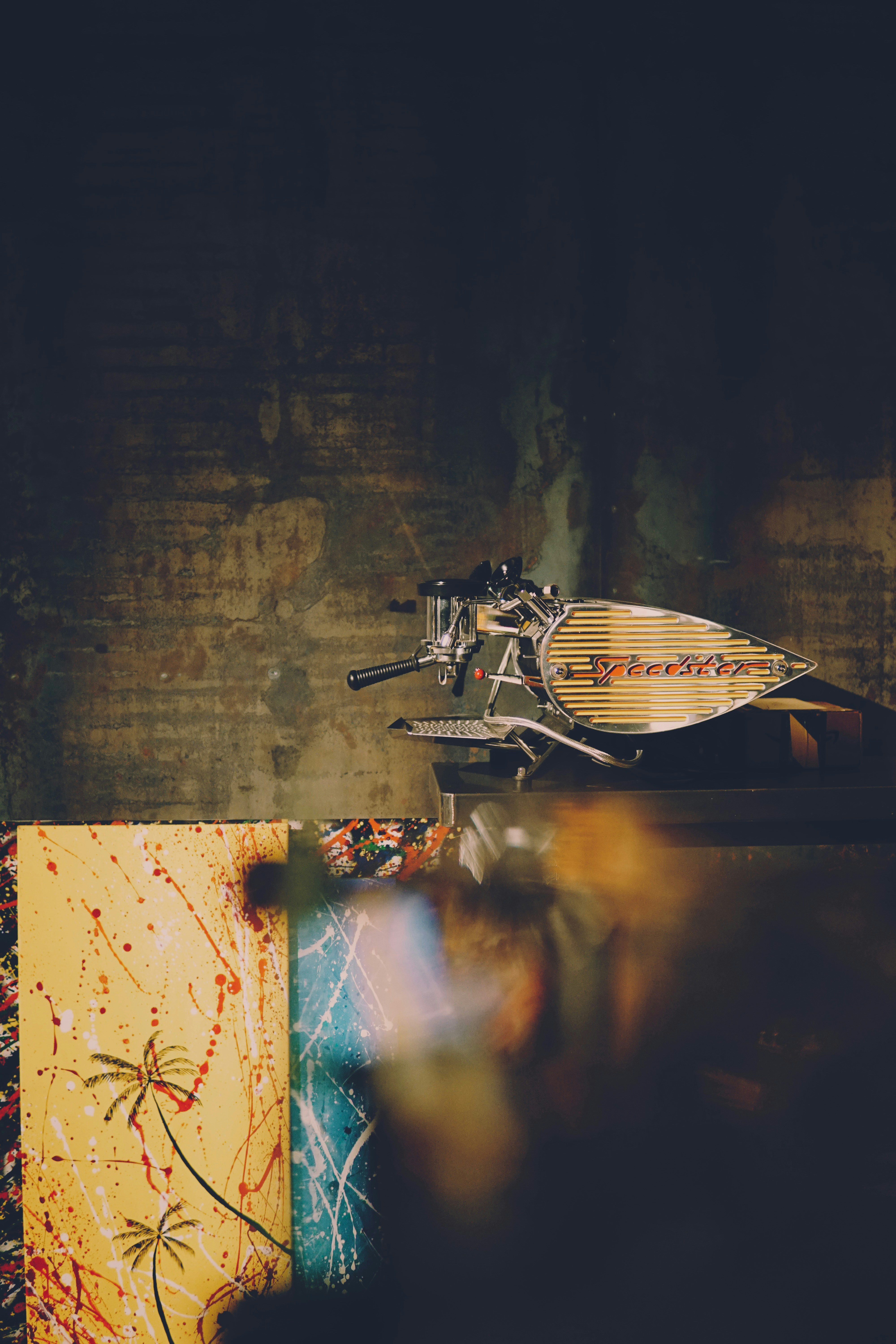 Gilded Tremolo: A Vintage Guitar-Shaped Instrument Anchored in Shadow