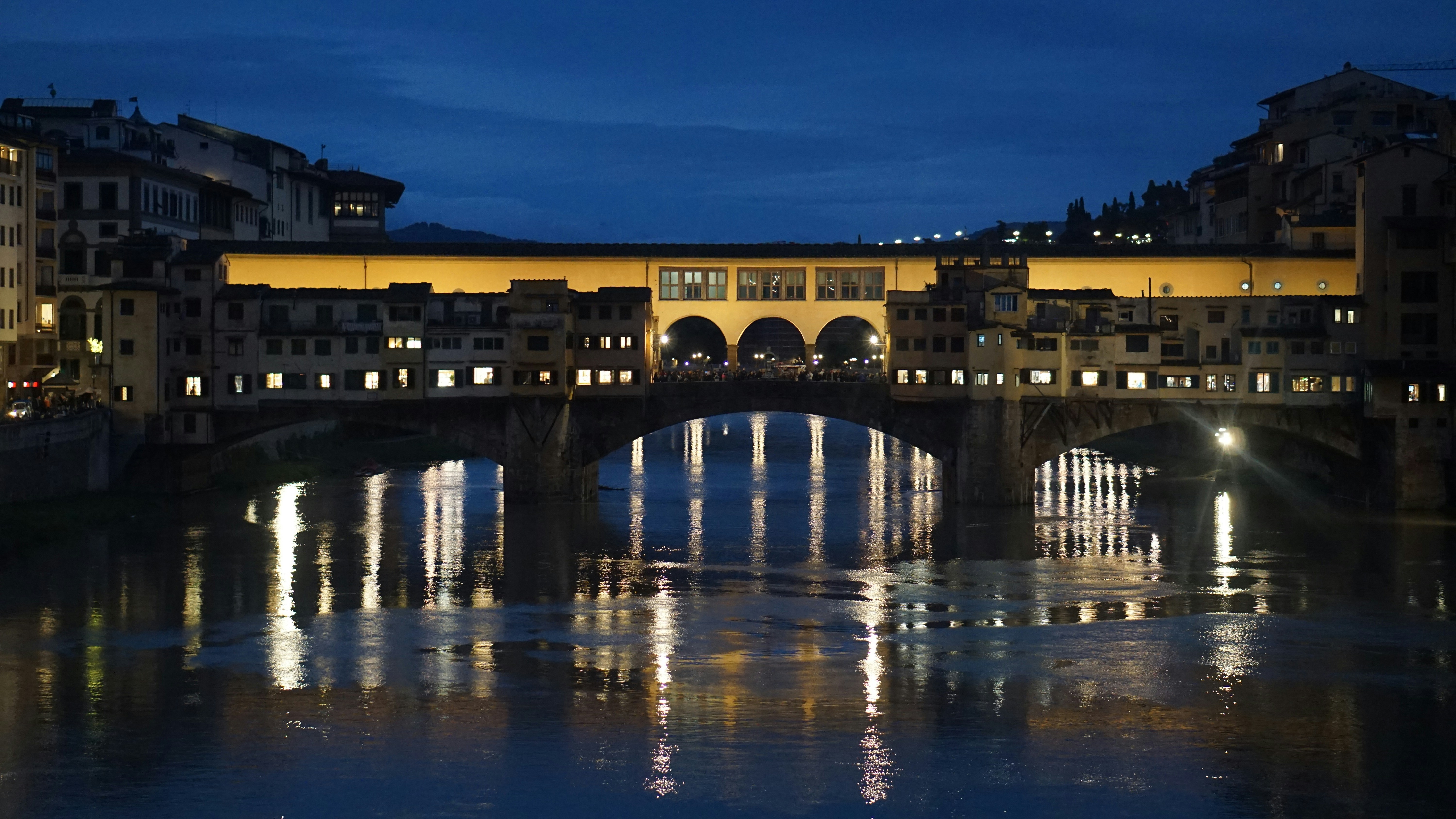 Illuminated Arches Over Serene WatersKaan Yener