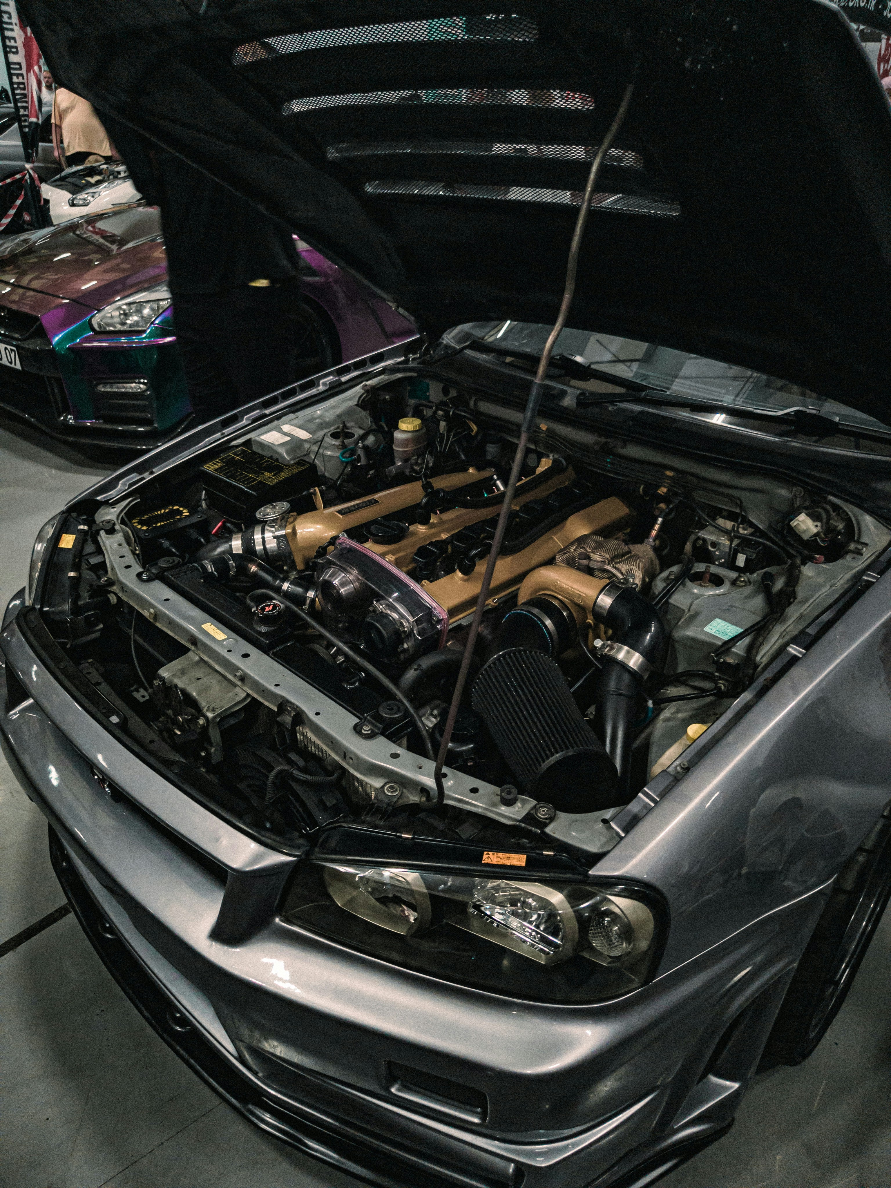 A silver car with its hood open in a garage photo – Free Nissan gtr r34 ...