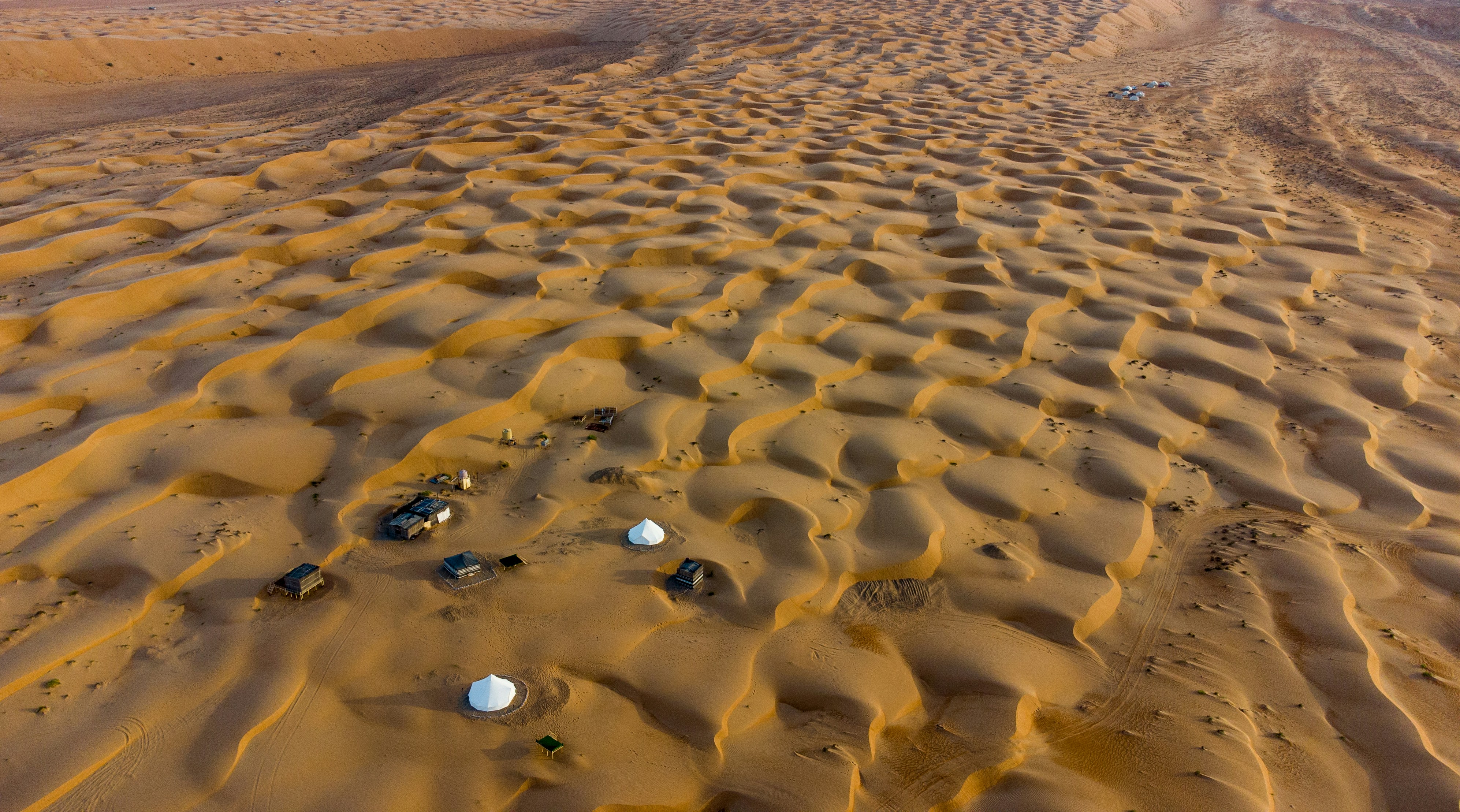 A sandy area with a lot of sand dunes photo – Free Brown Image on Unsplash