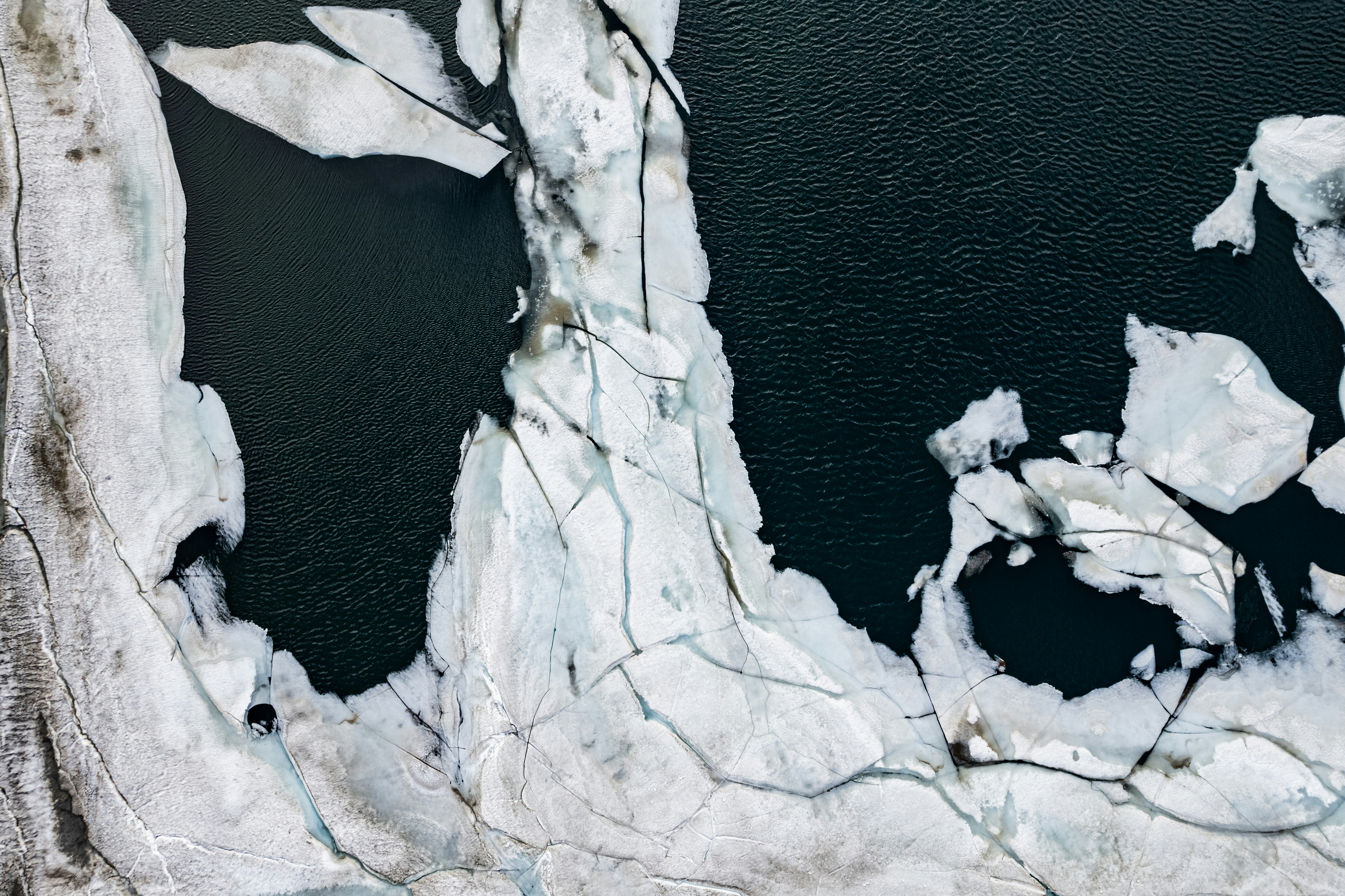 An aerial view of a large iceberg in the water photo – Free Nature ...