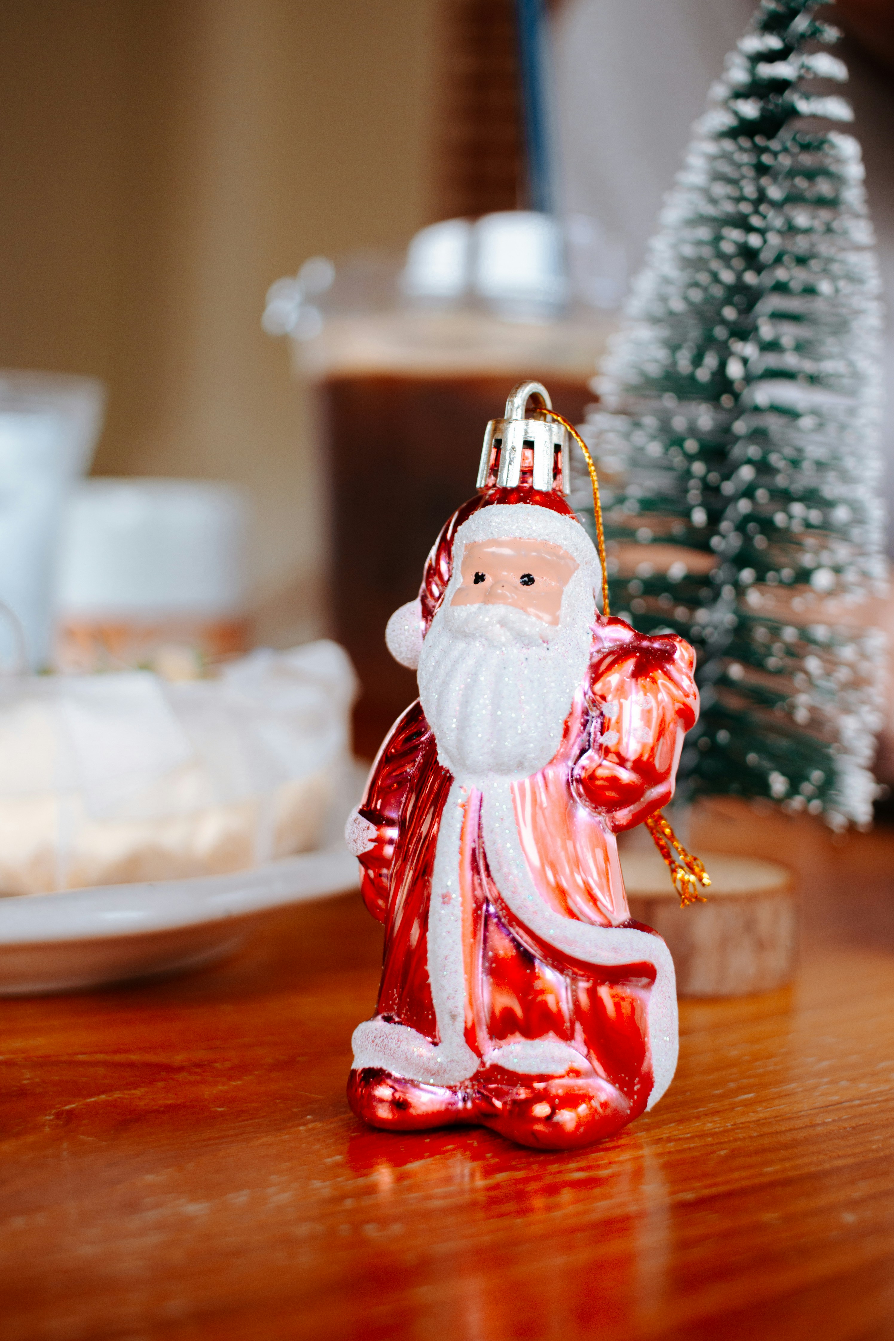 Shiny Santa Figurine Centerstage on a Festive Table